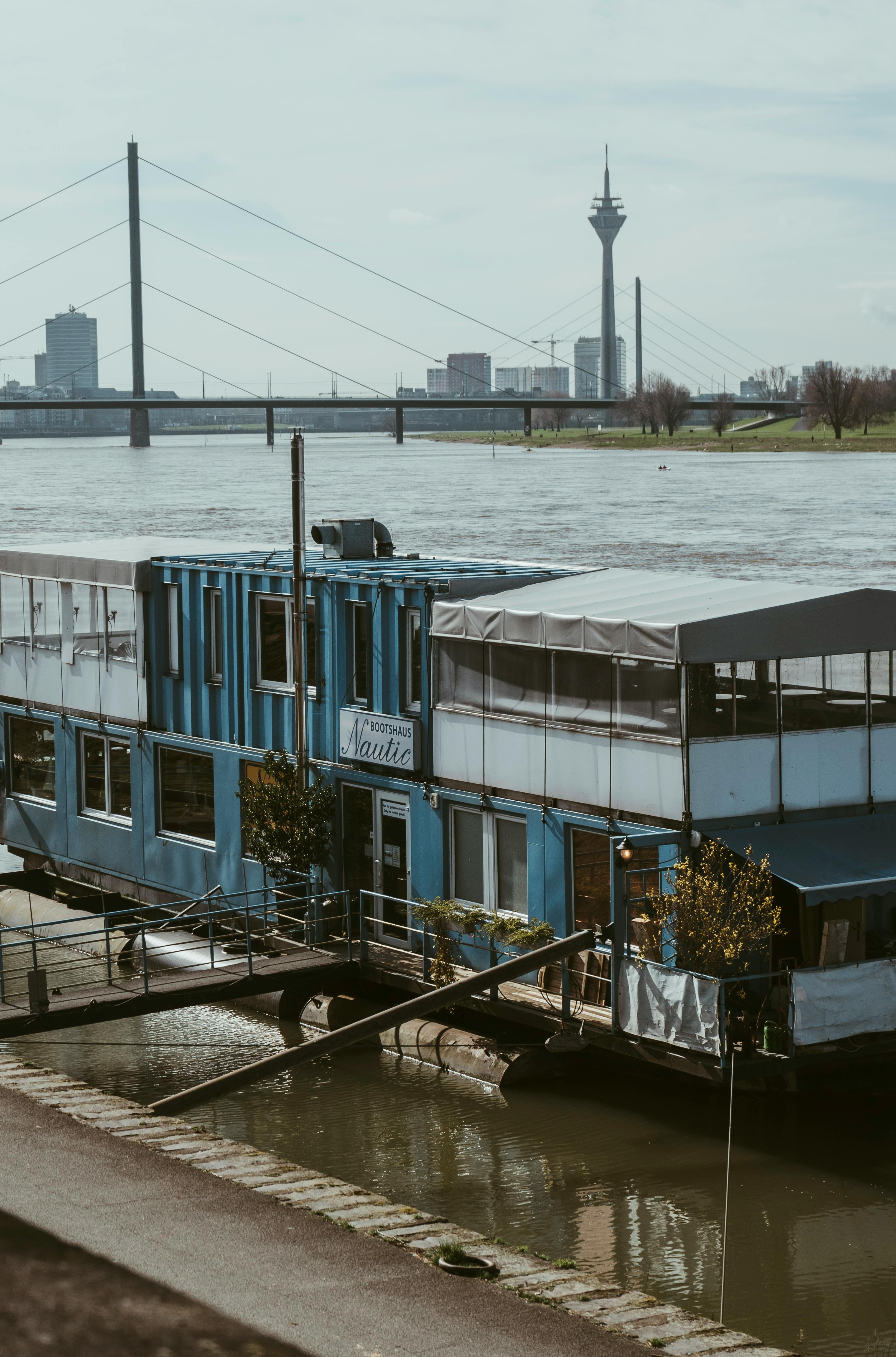 Boat House Nautic Moored on the River Bank · Free Stock Photo