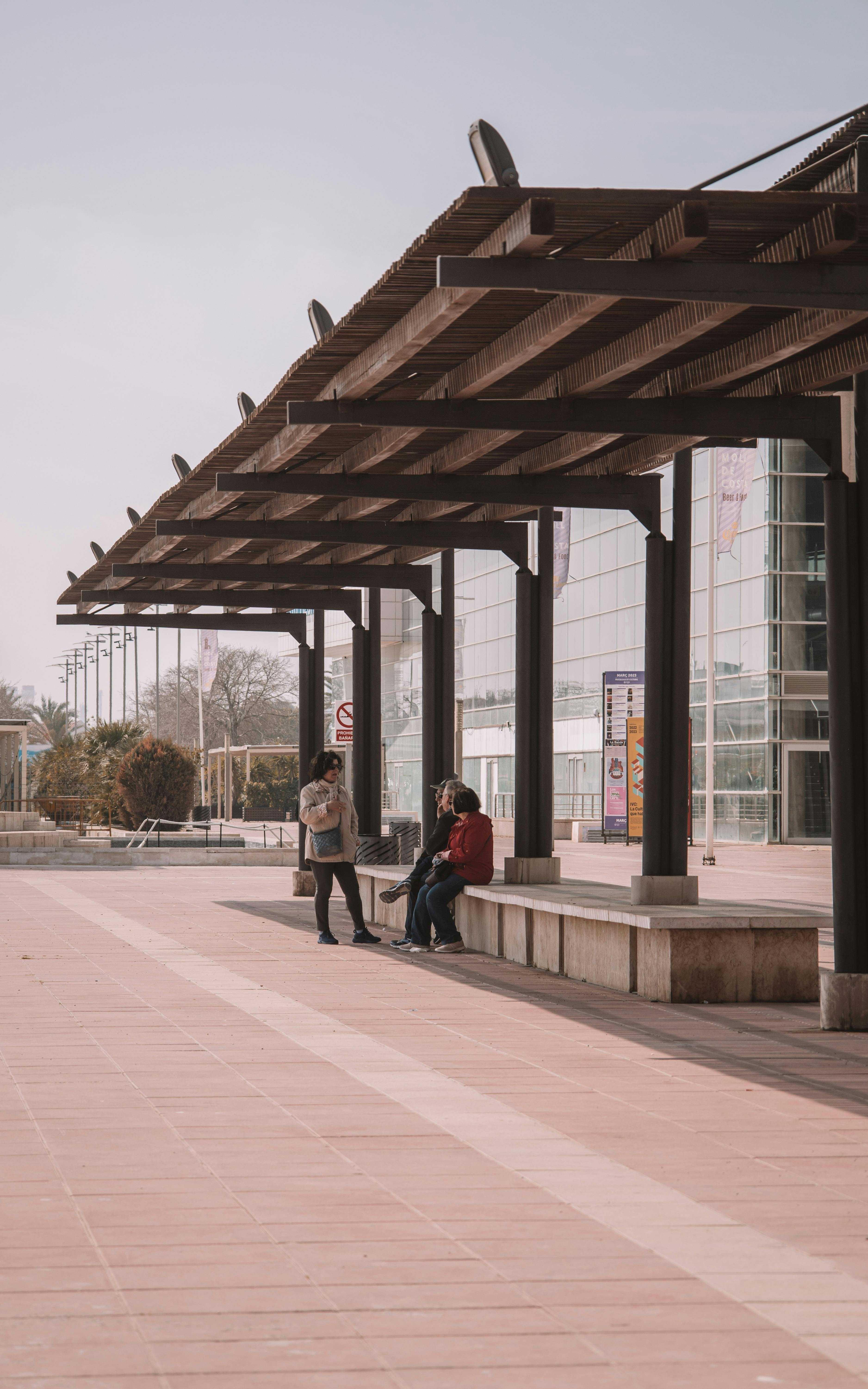 Benches on a Waiting Shed During Night time · Free Stock Photo