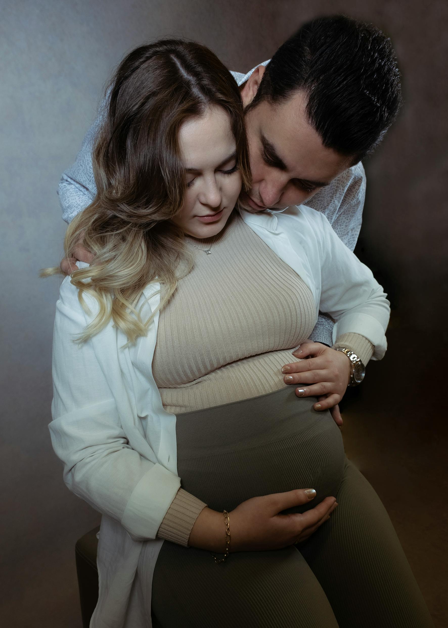 Man and Pregnant Woman Hugging and Touching the Womans Stomach · Free ...