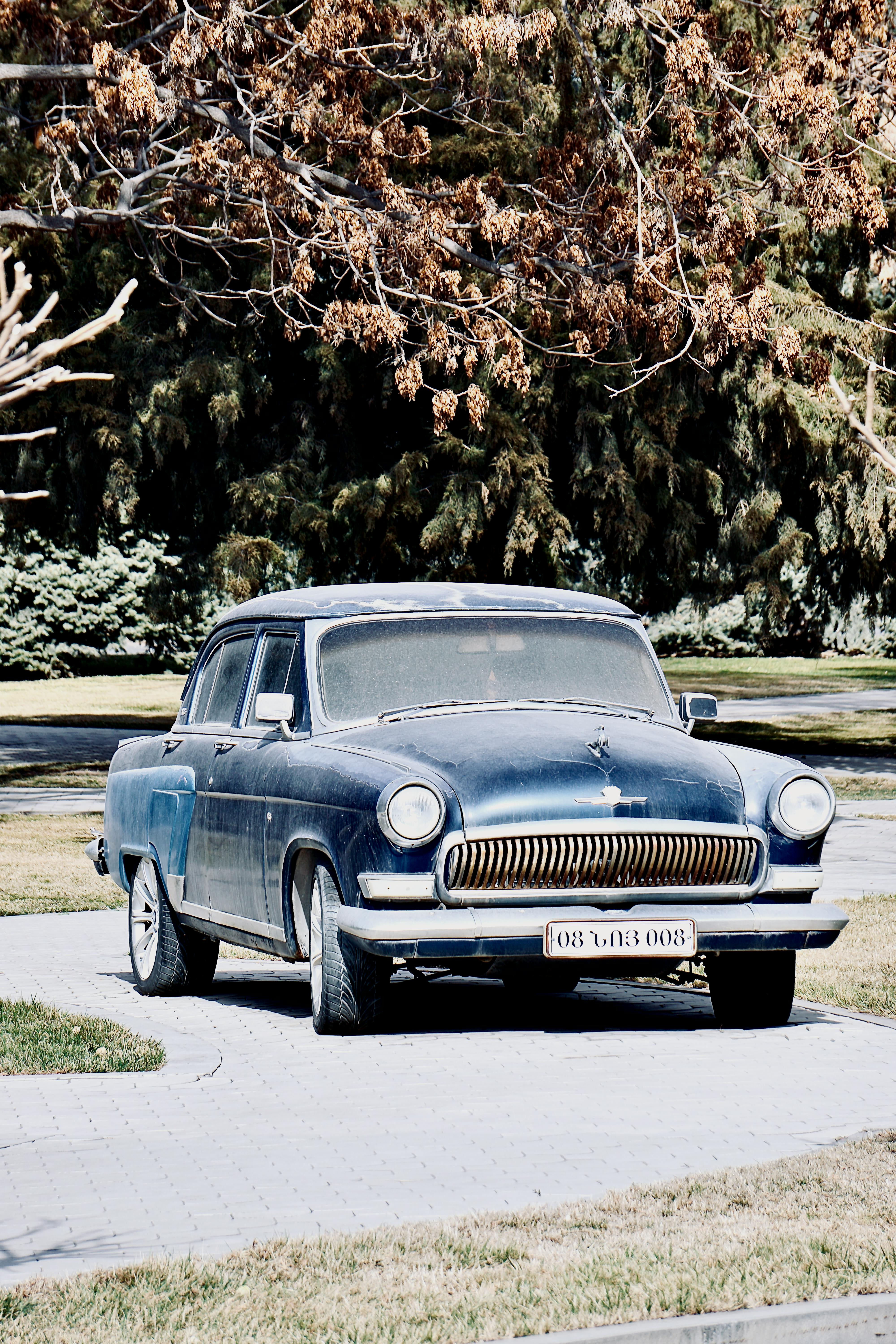 Retro Blue Car on Pavement · Free Stock Photo
