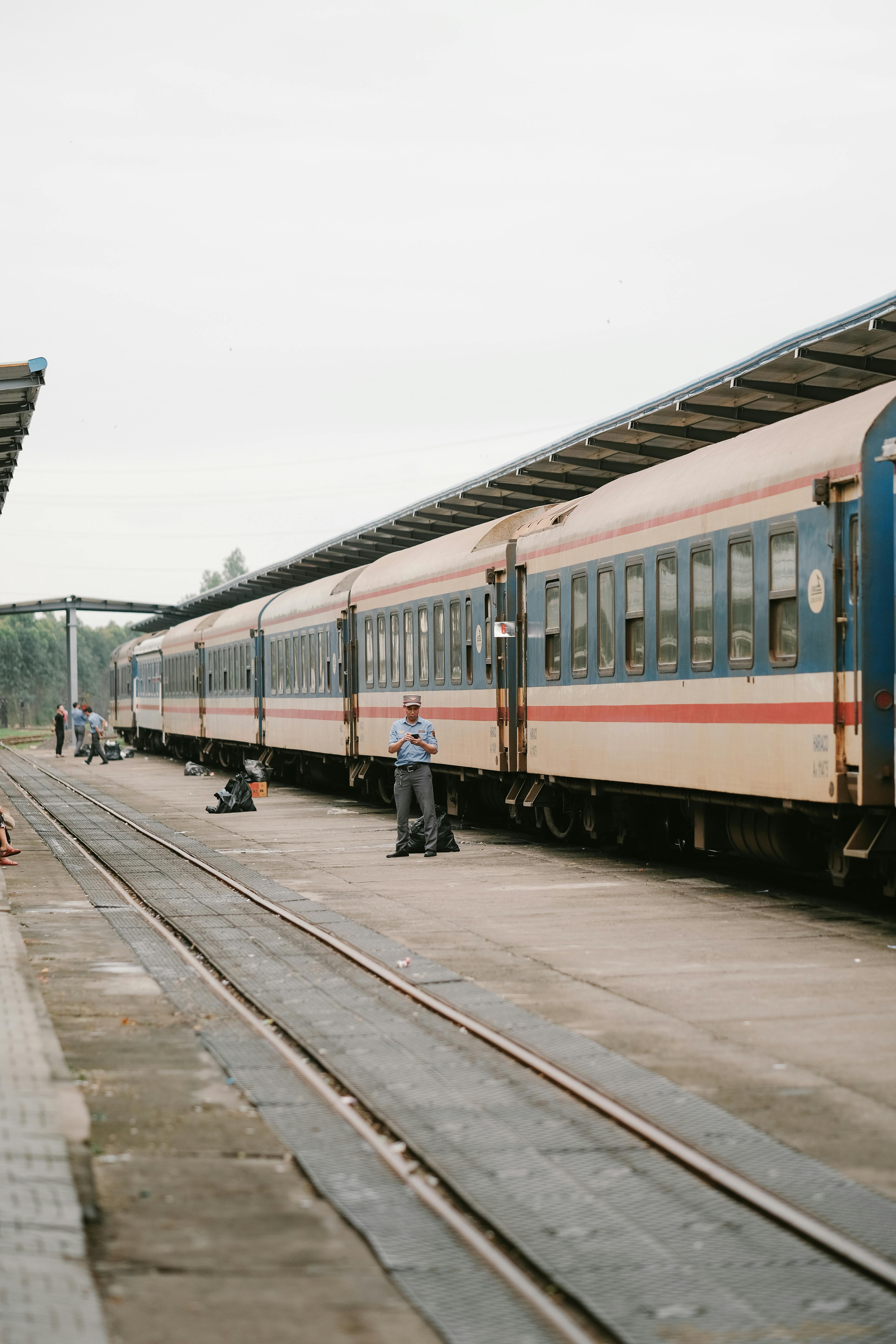 Passenger Train at the Railway Station · Free Stock Photo