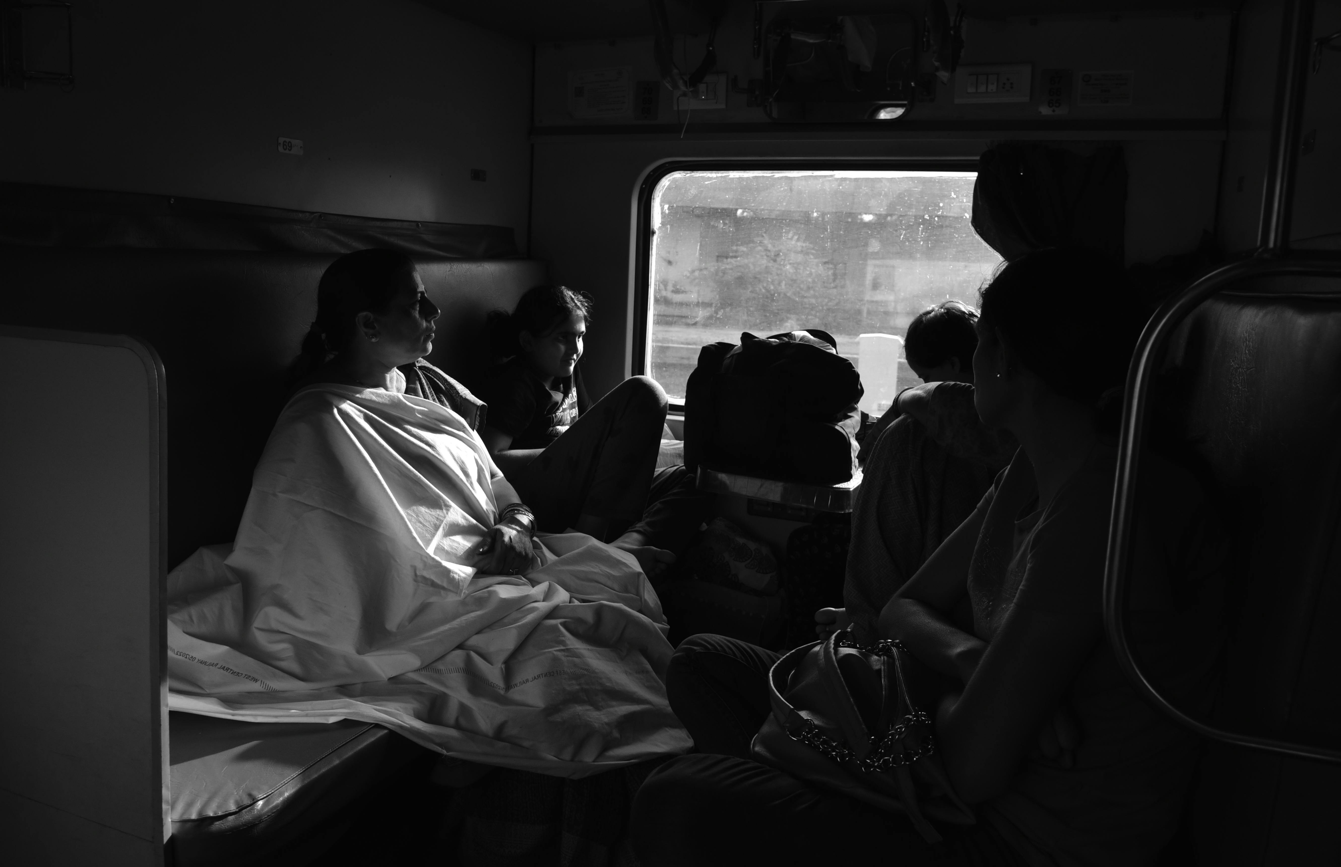 People Sitting in the Train Compartment · Free Stock Photo