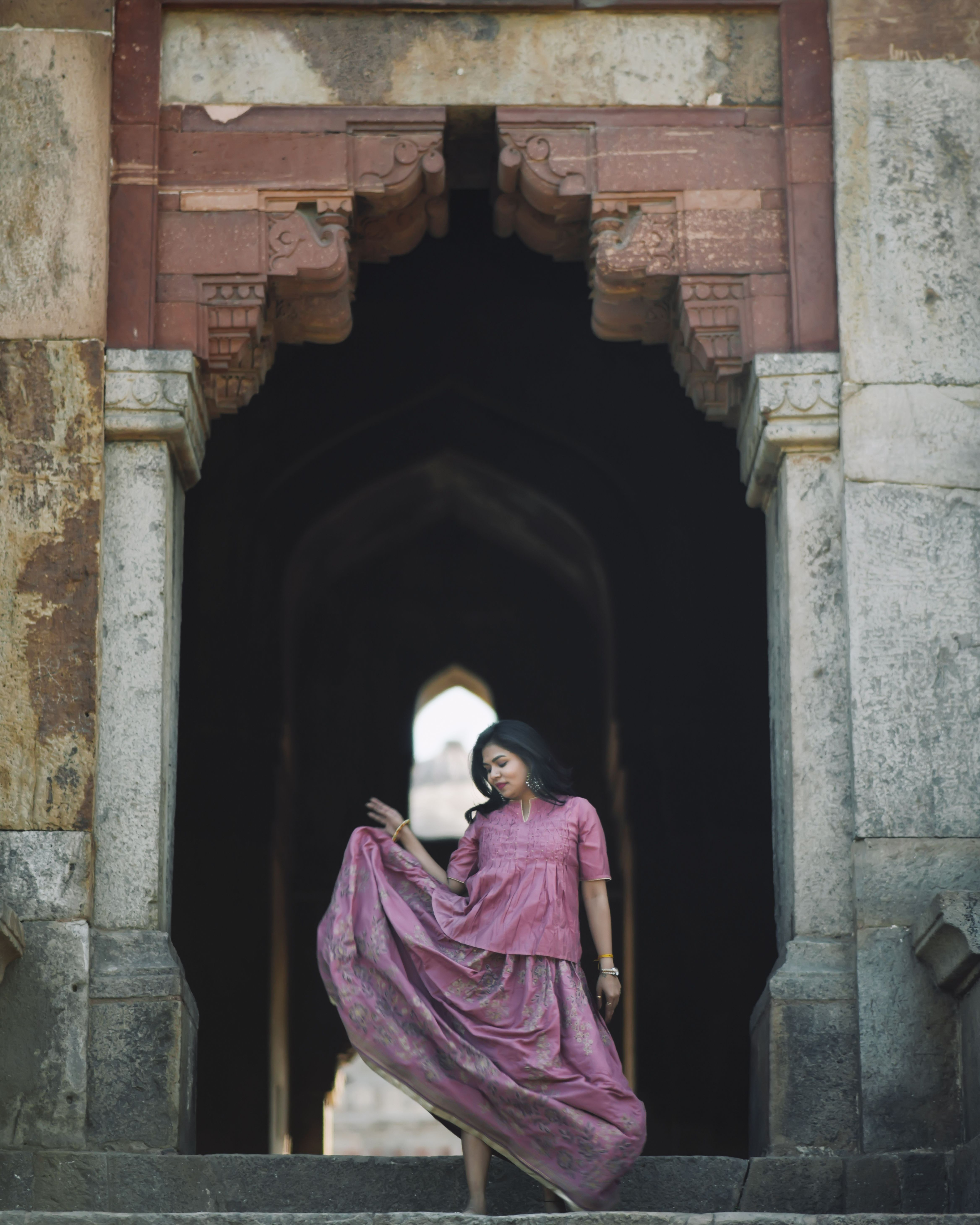 Woman in a Traditional Dress Standing in front of a Temple · Free Stock ...