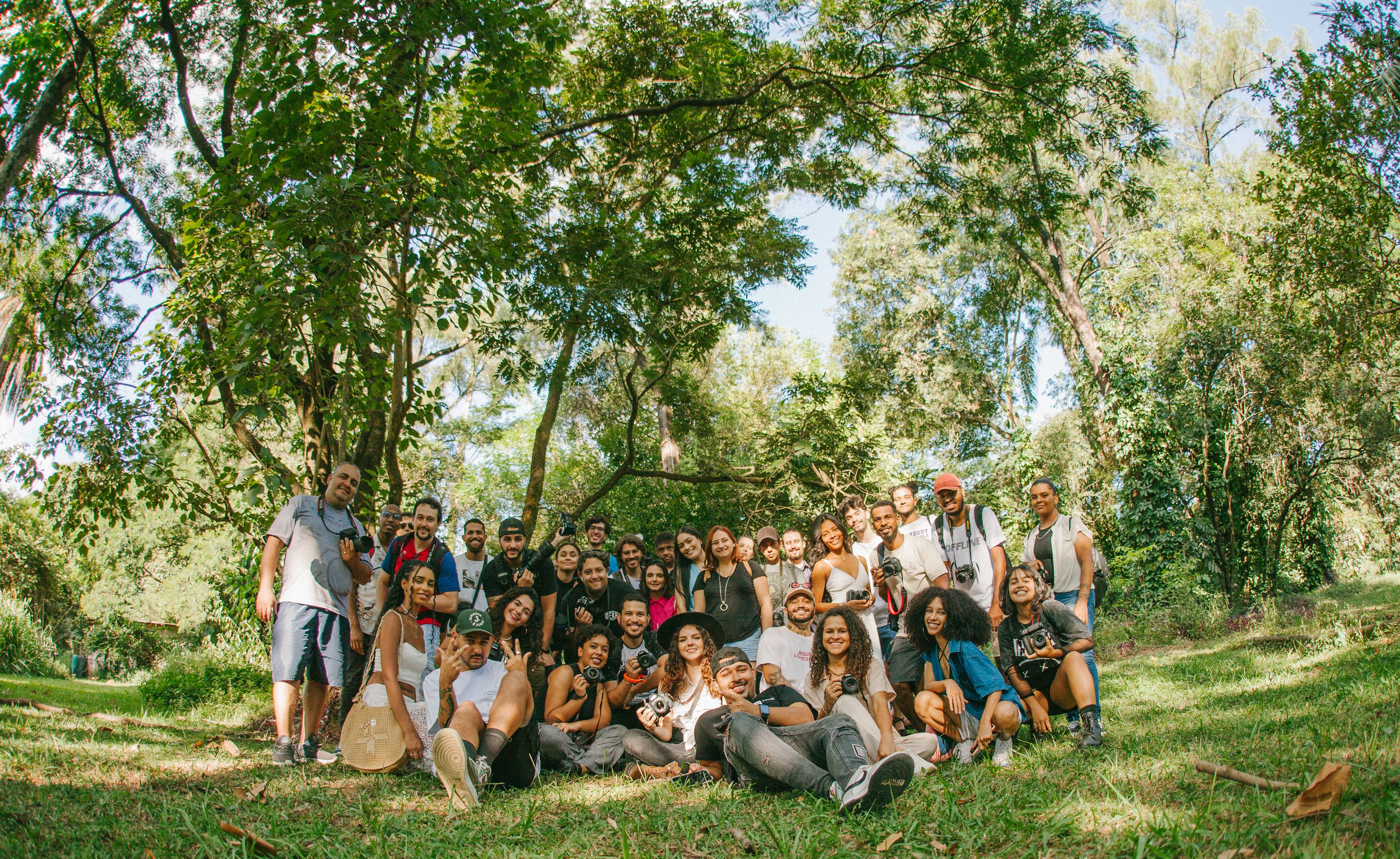 Group of People Posing under Trees in Park · Free Stock Photo