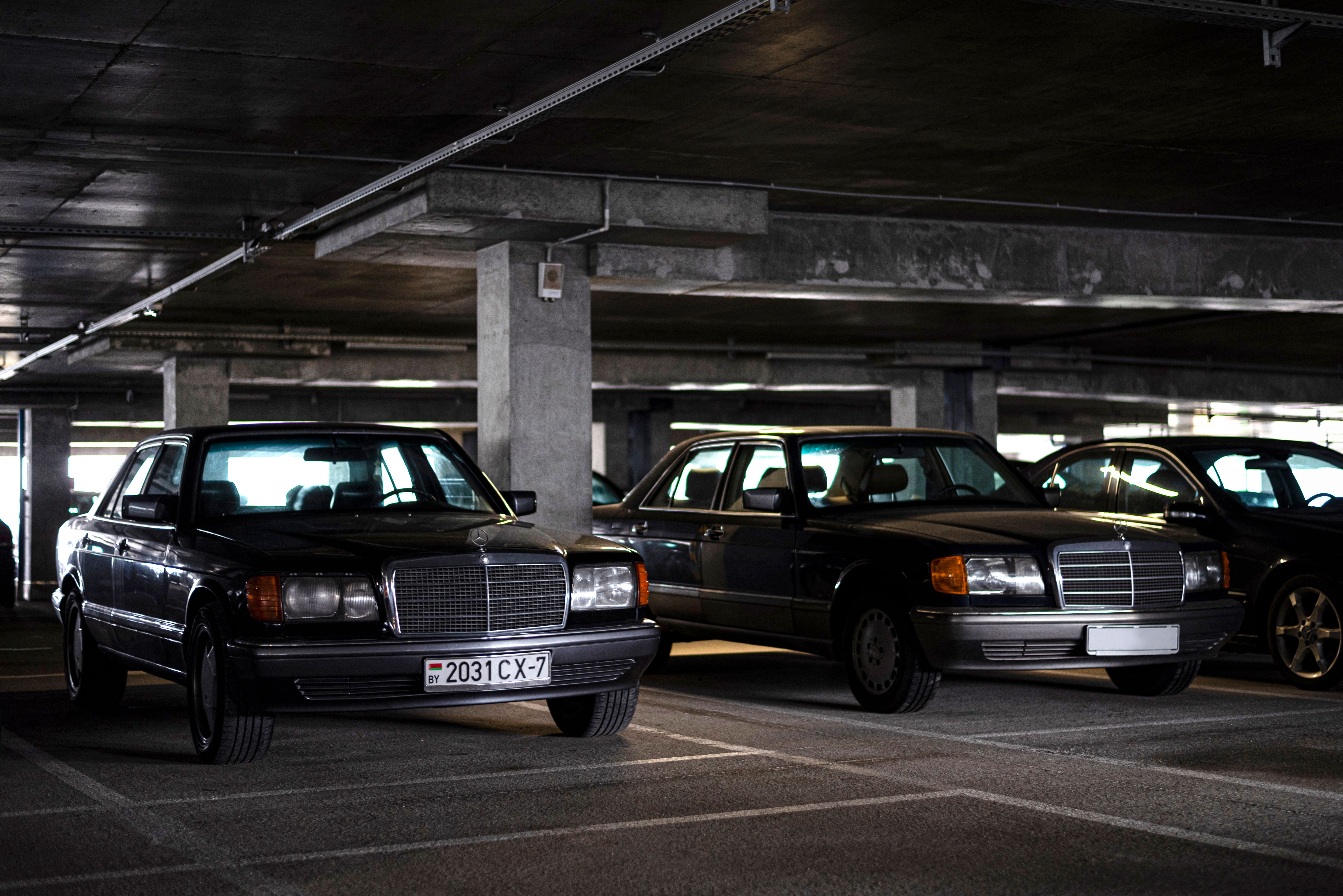 Vintage Mercedes Parked in a Roofed Parking Lot · Free Stock Photo