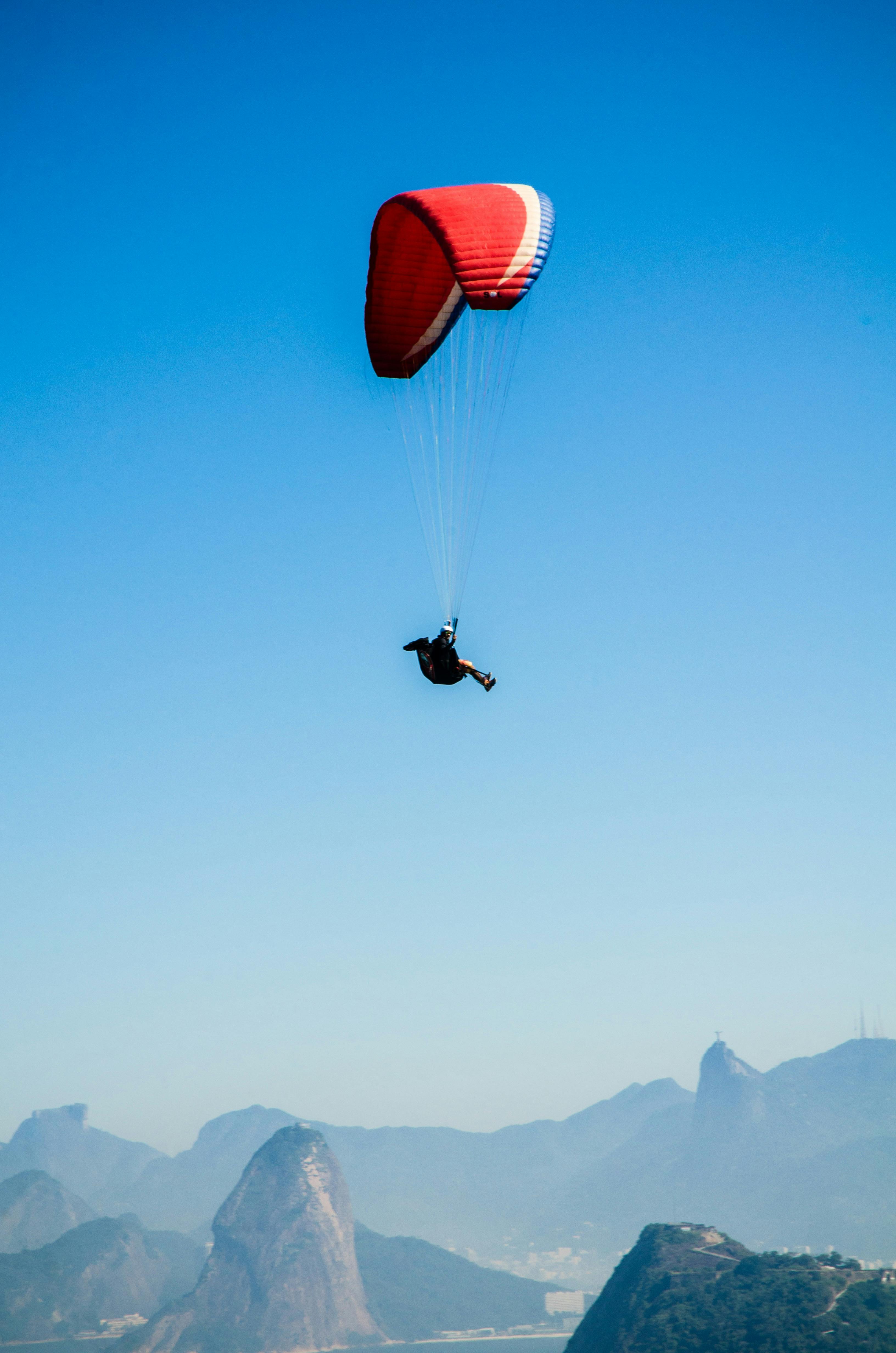 Panorama Photo of a Person Parachuting Above Volcano Lake during ...