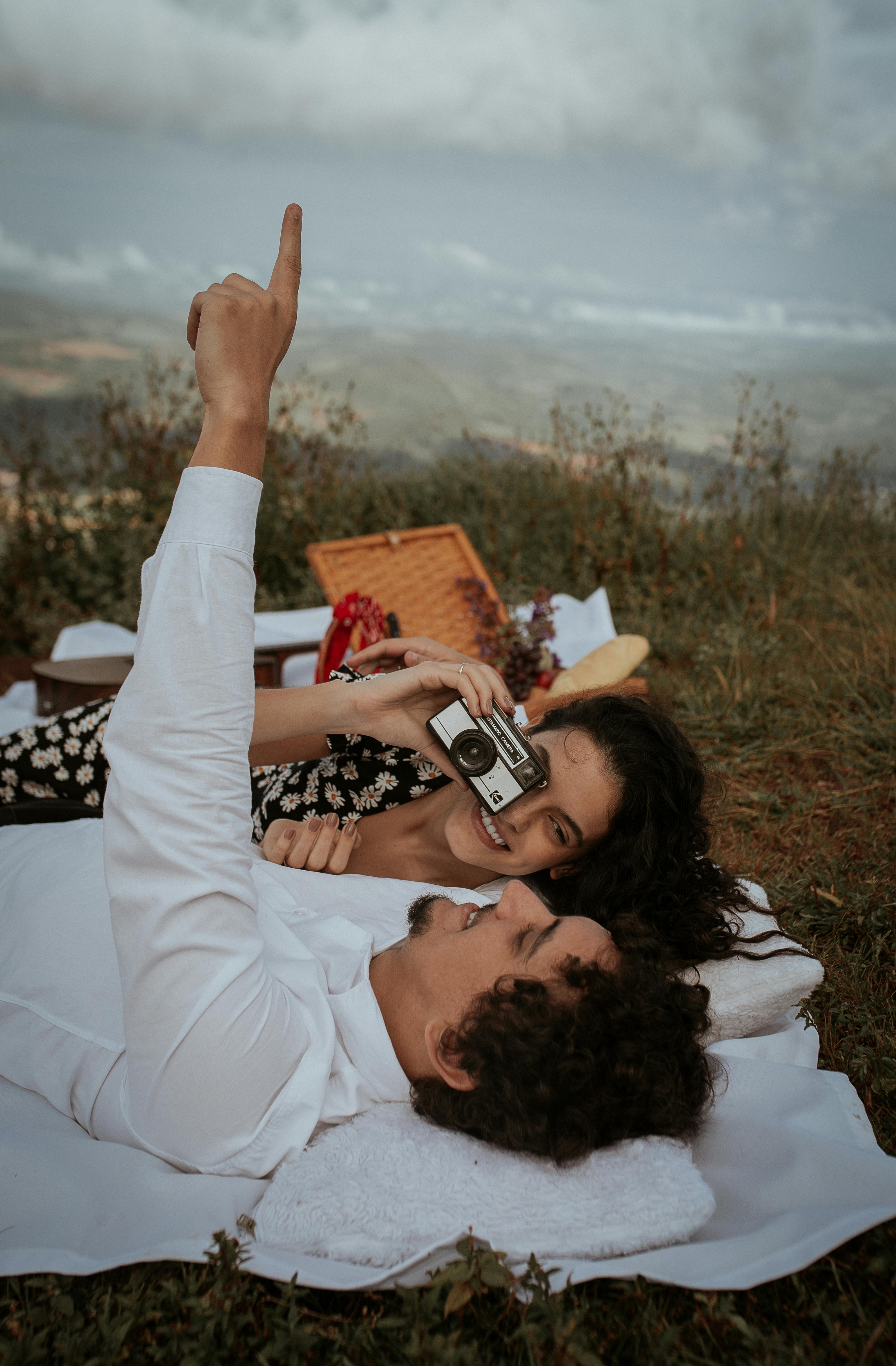 Moon Rising over an Embracing Couple · Free Stock Photo