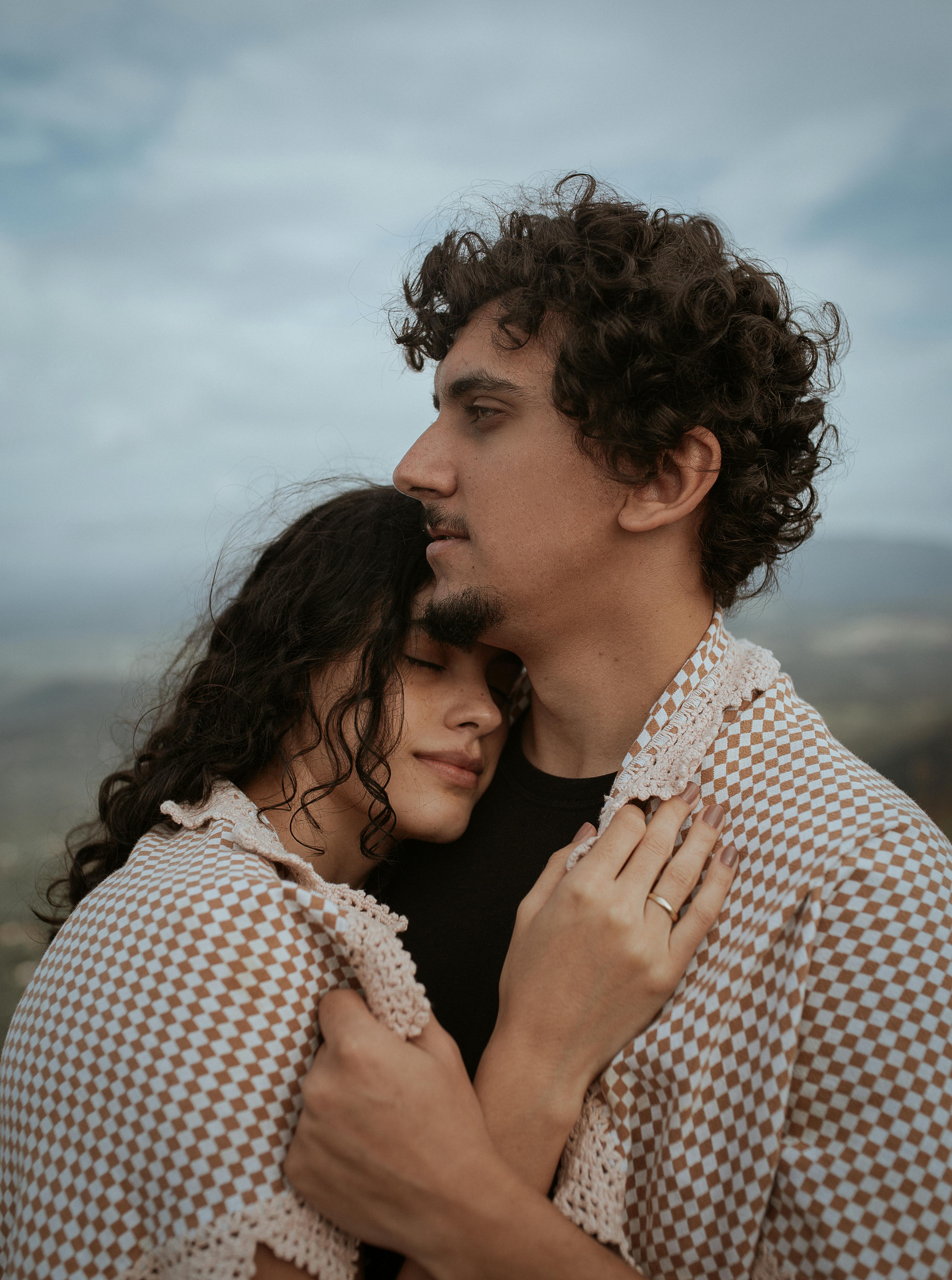 A Couple Wearing Jackets Hugging · Free Stock Photo