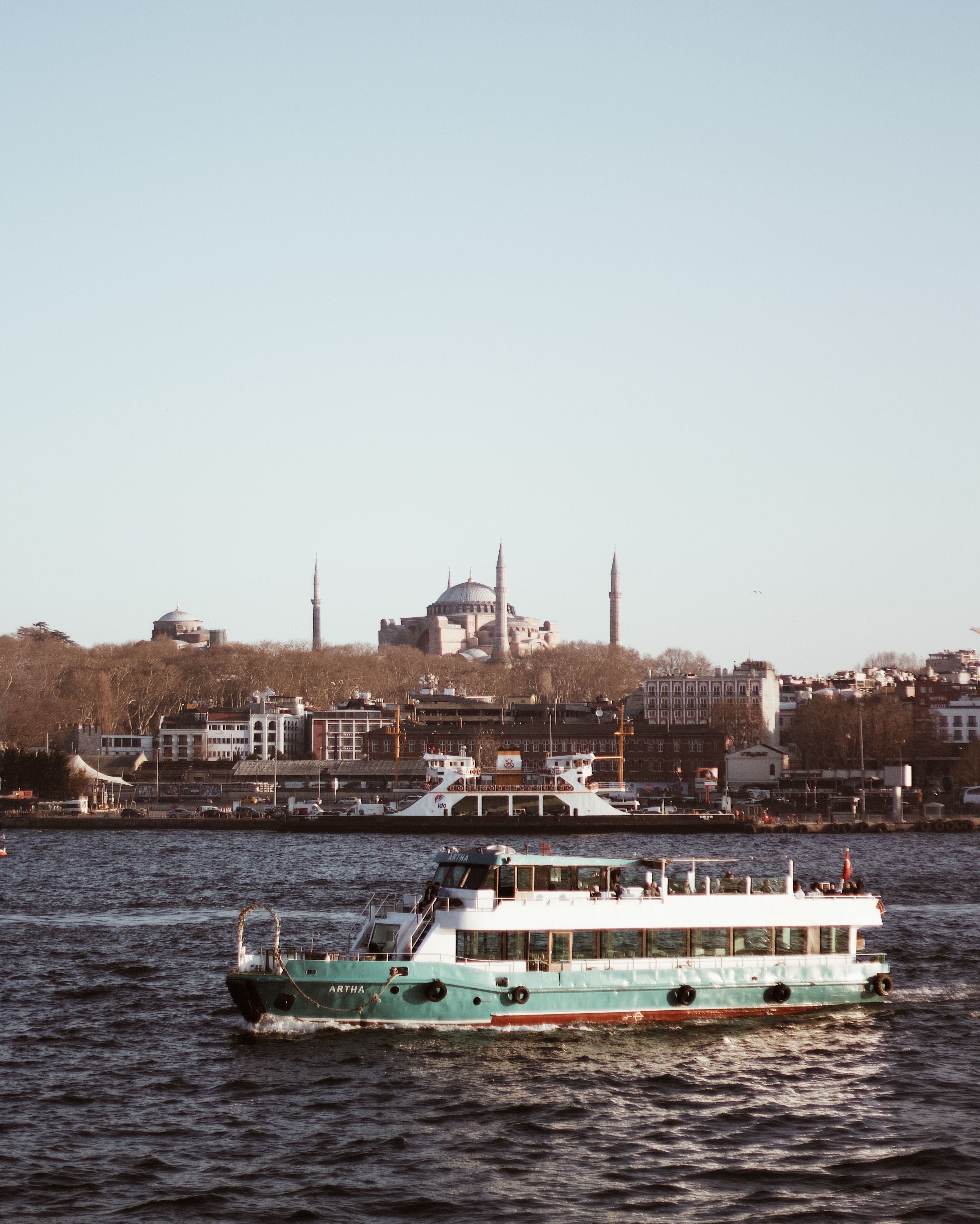Photo of a Ferry with a View of a Suspension Bridge · Free Stock Photo
