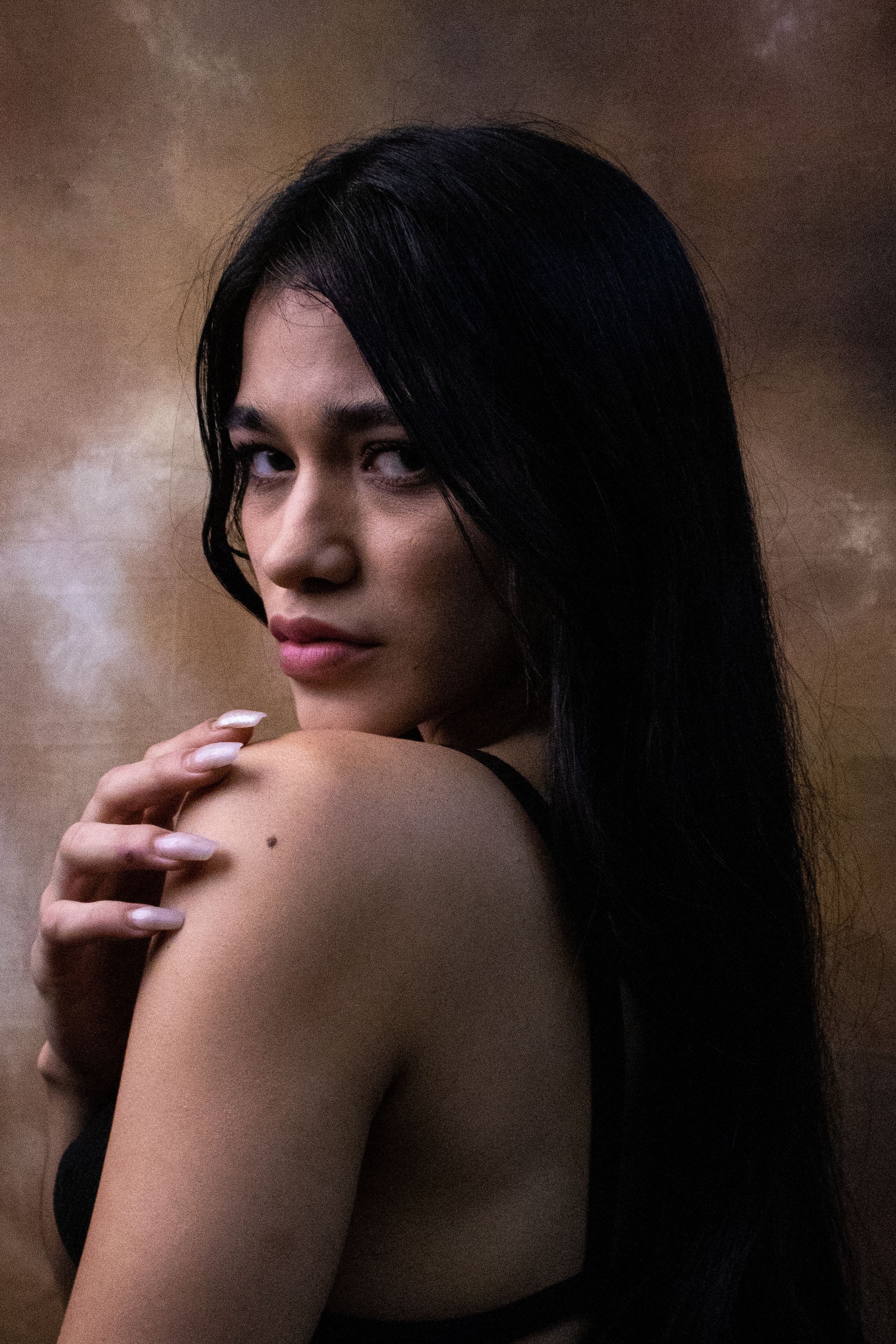 Portrait of a Woman Looking Over her Shoulder · Free Stock Photo
