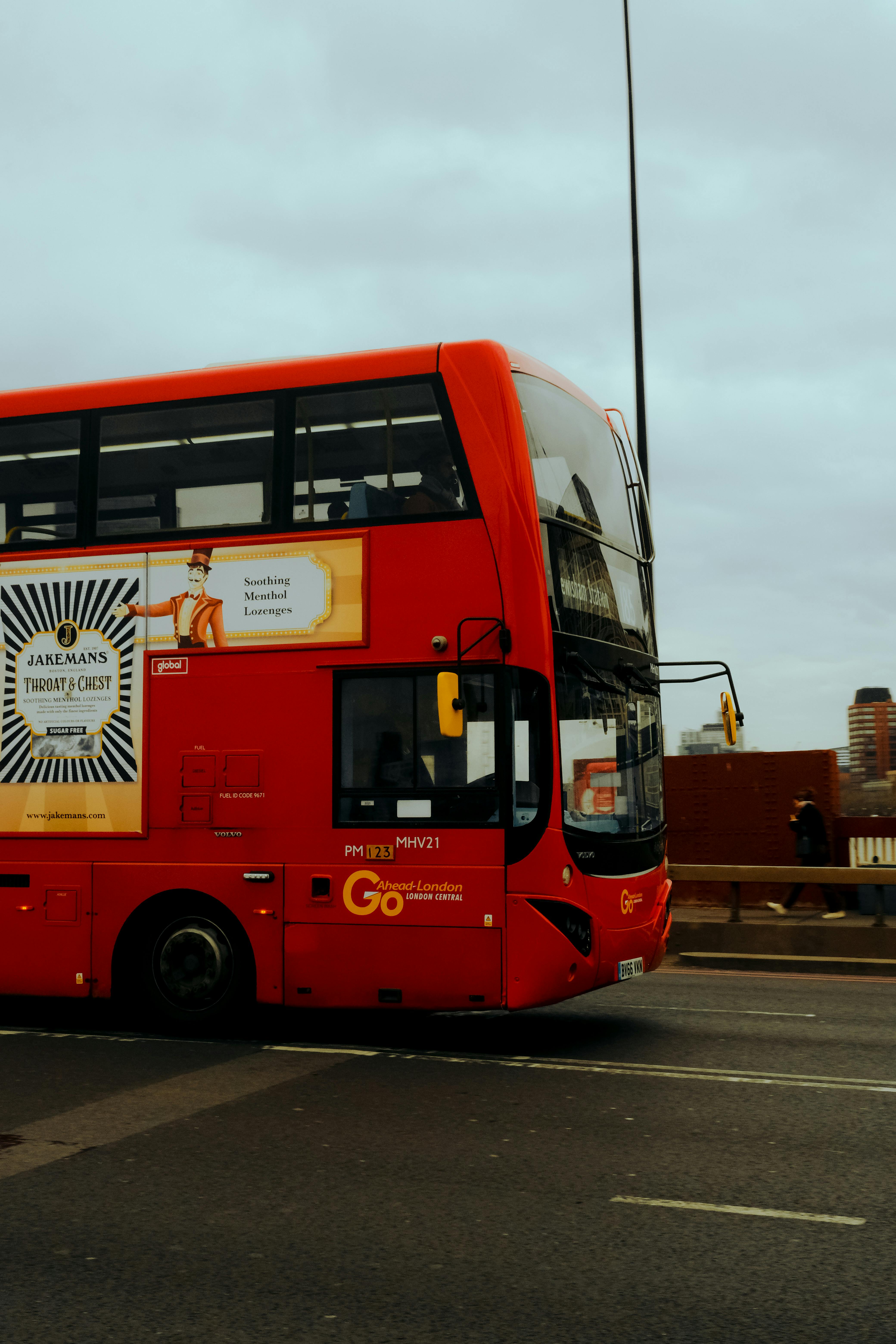Red Bus under Clouds · Free Stock Photo
