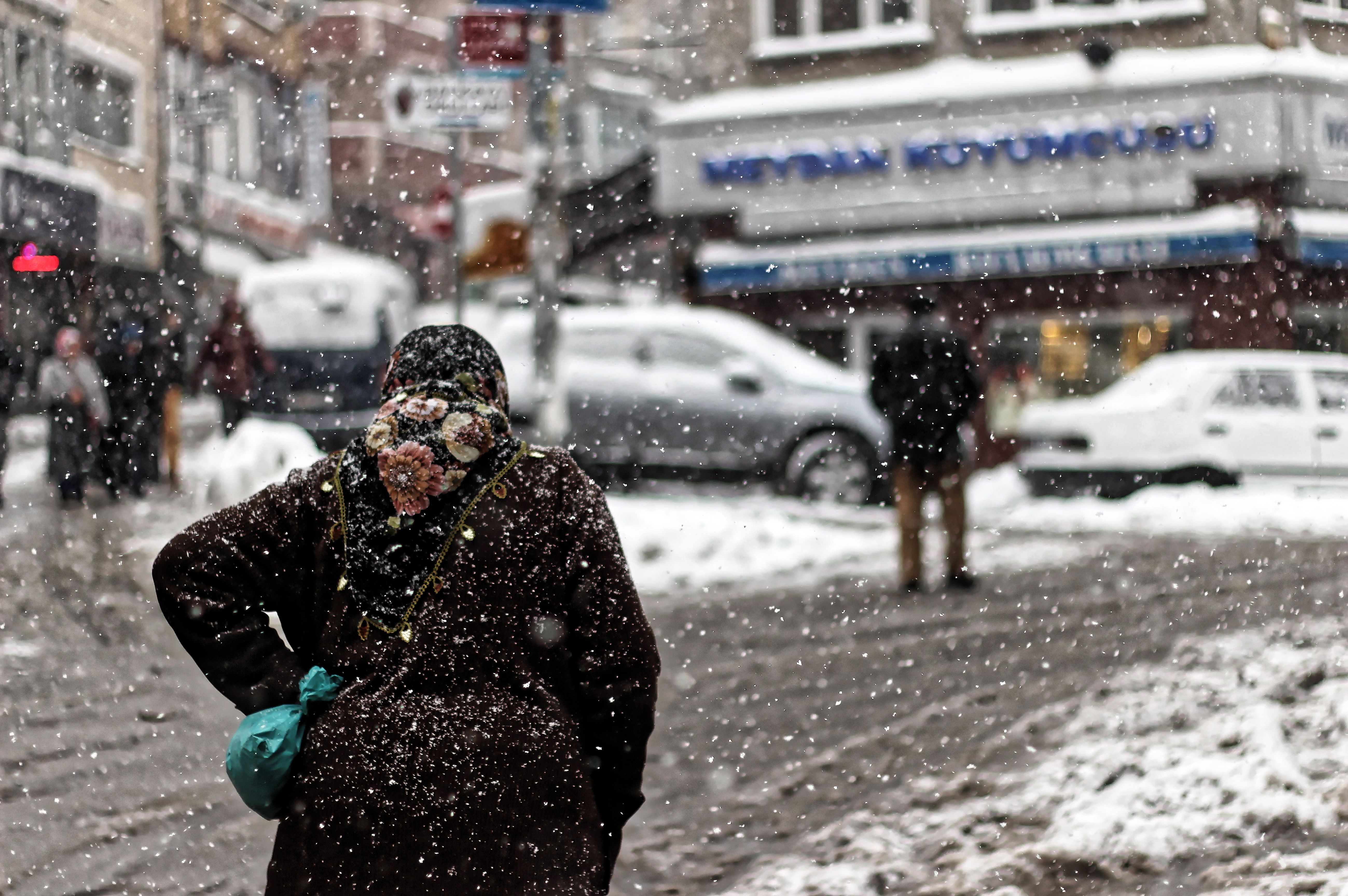 People Walking on a Street in City in Heavy Snow · Free Stock Photo