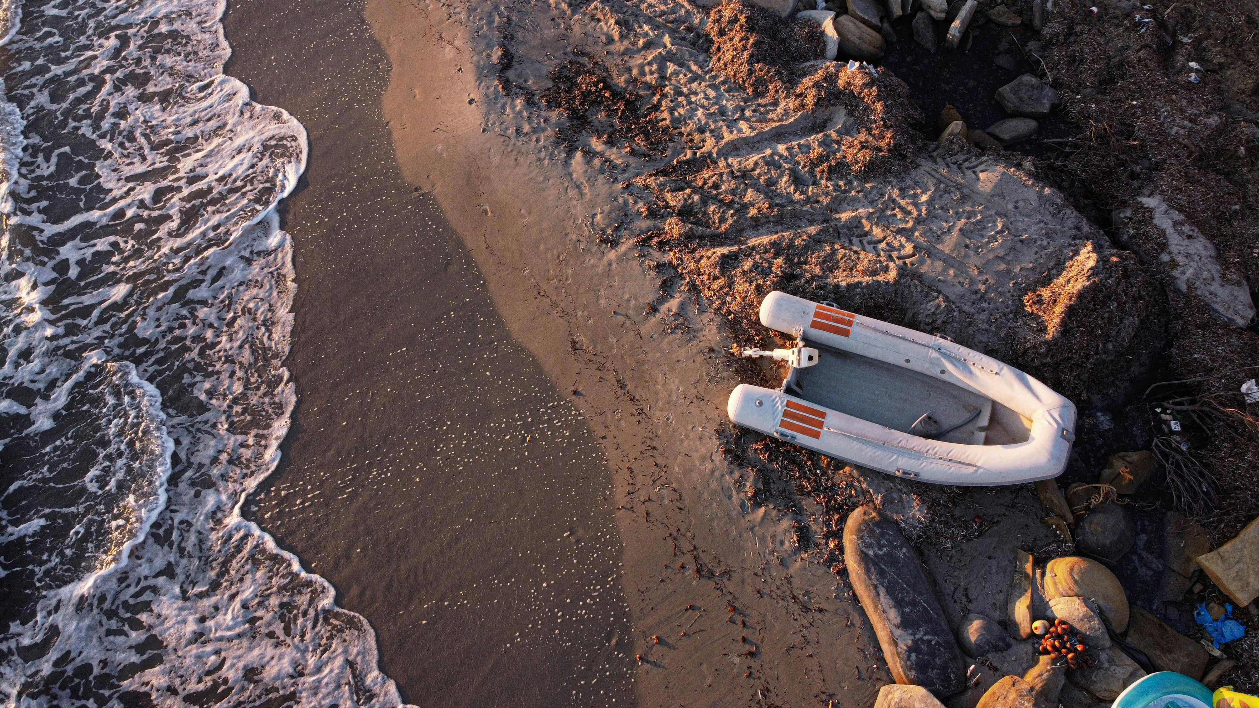 Top View of an Inflatable Pontoon on a Beach and Waves Washing Up the ...