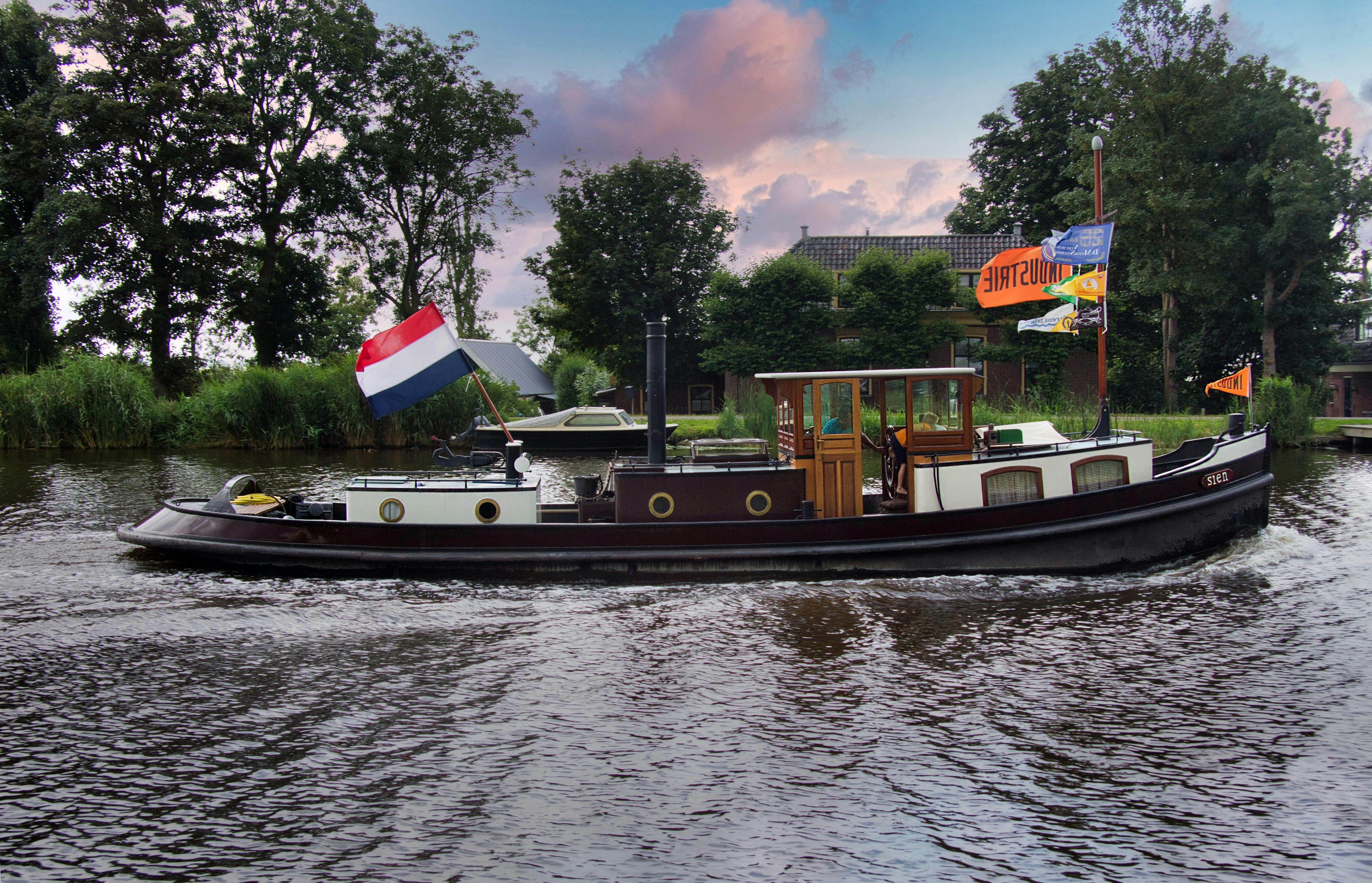 Dutch Boat Sailing on River · Free Stock Photo