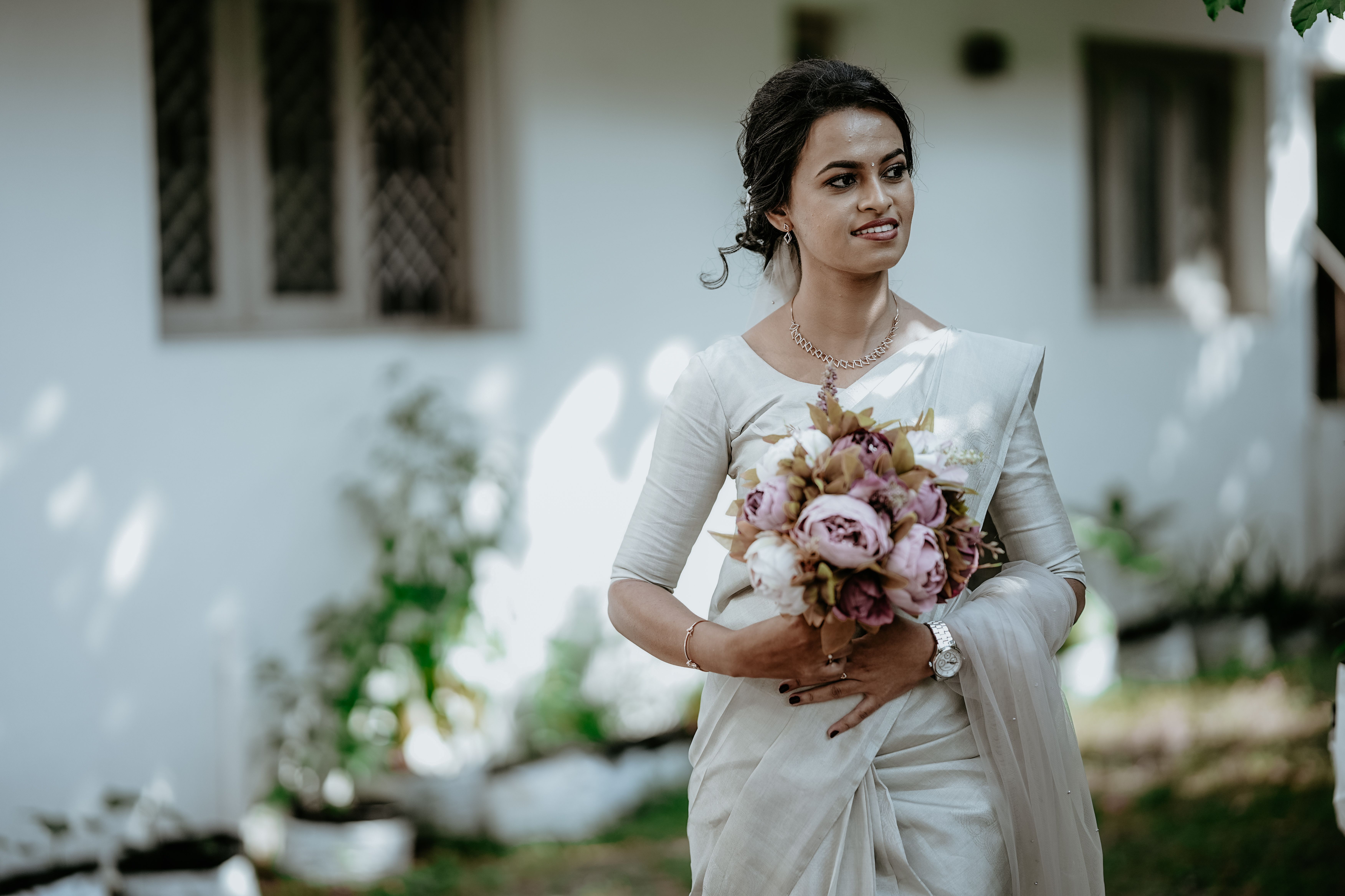 Smiling Bride Standing in Thoughtful Pose in Park or Garden · Free ...