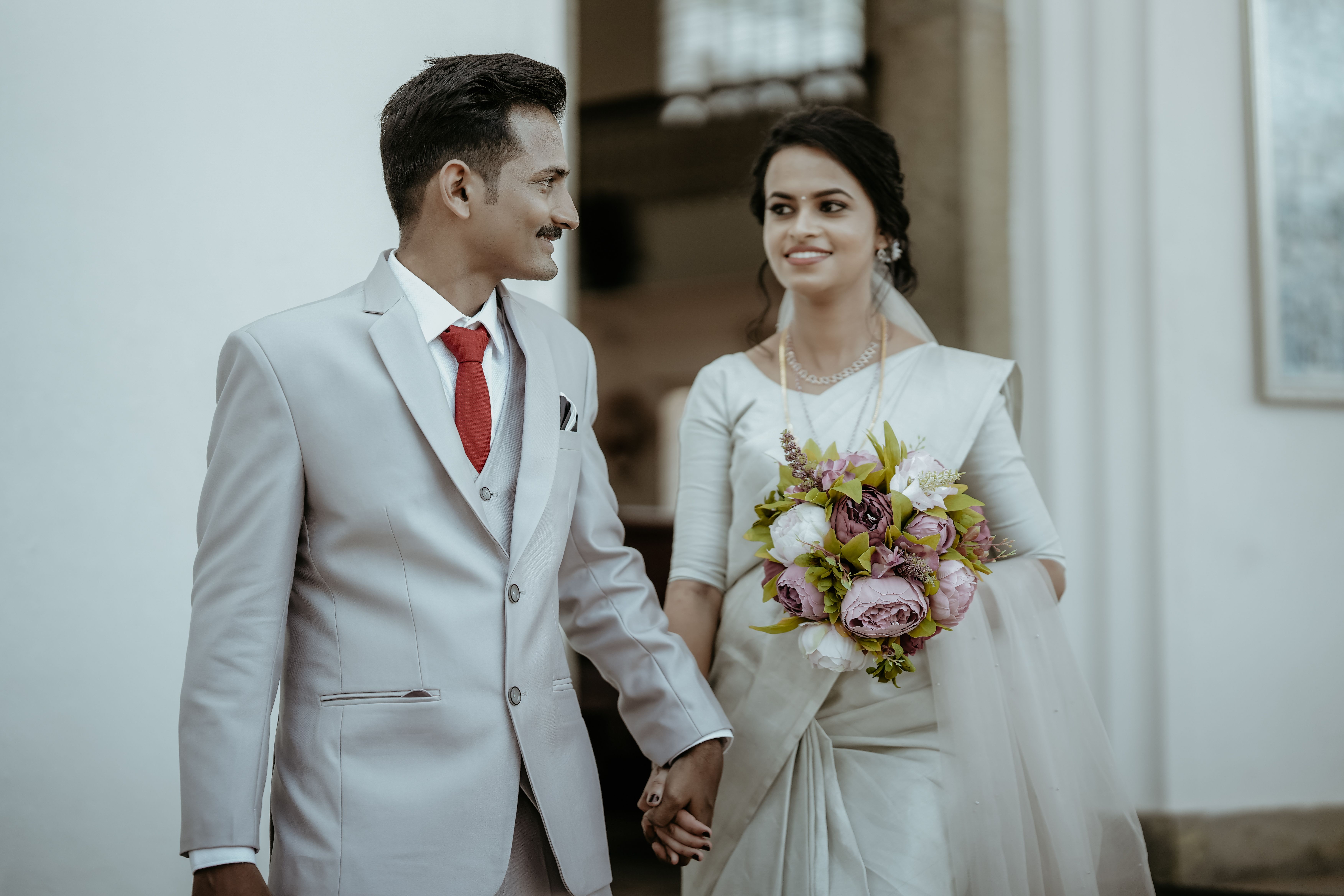 Newlyweds Posing in Traditional Clothing · Free Stock Photo