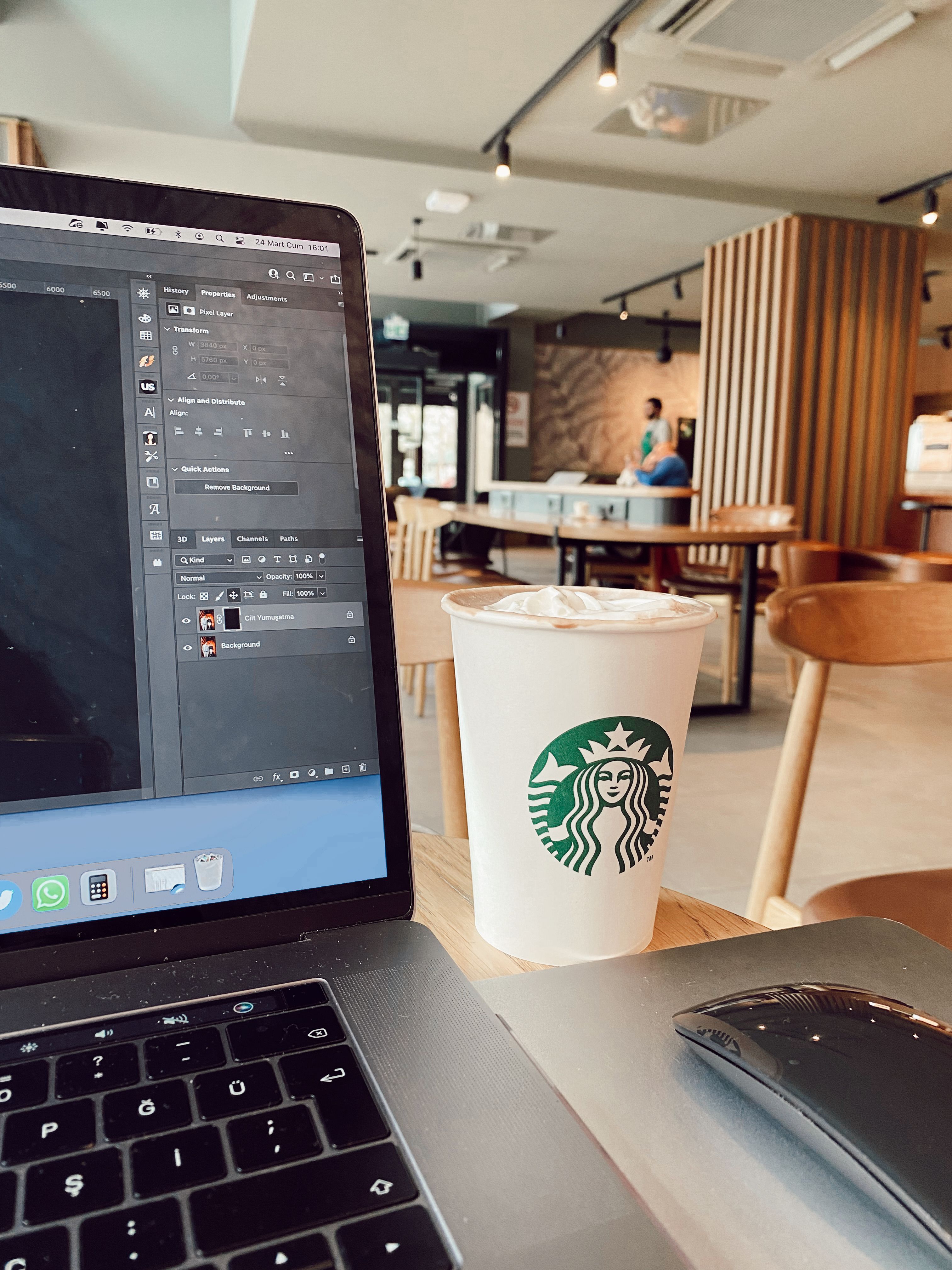 A Laptop and a Coffee on a Table in Starbucks Cafe · Free Stock Photo