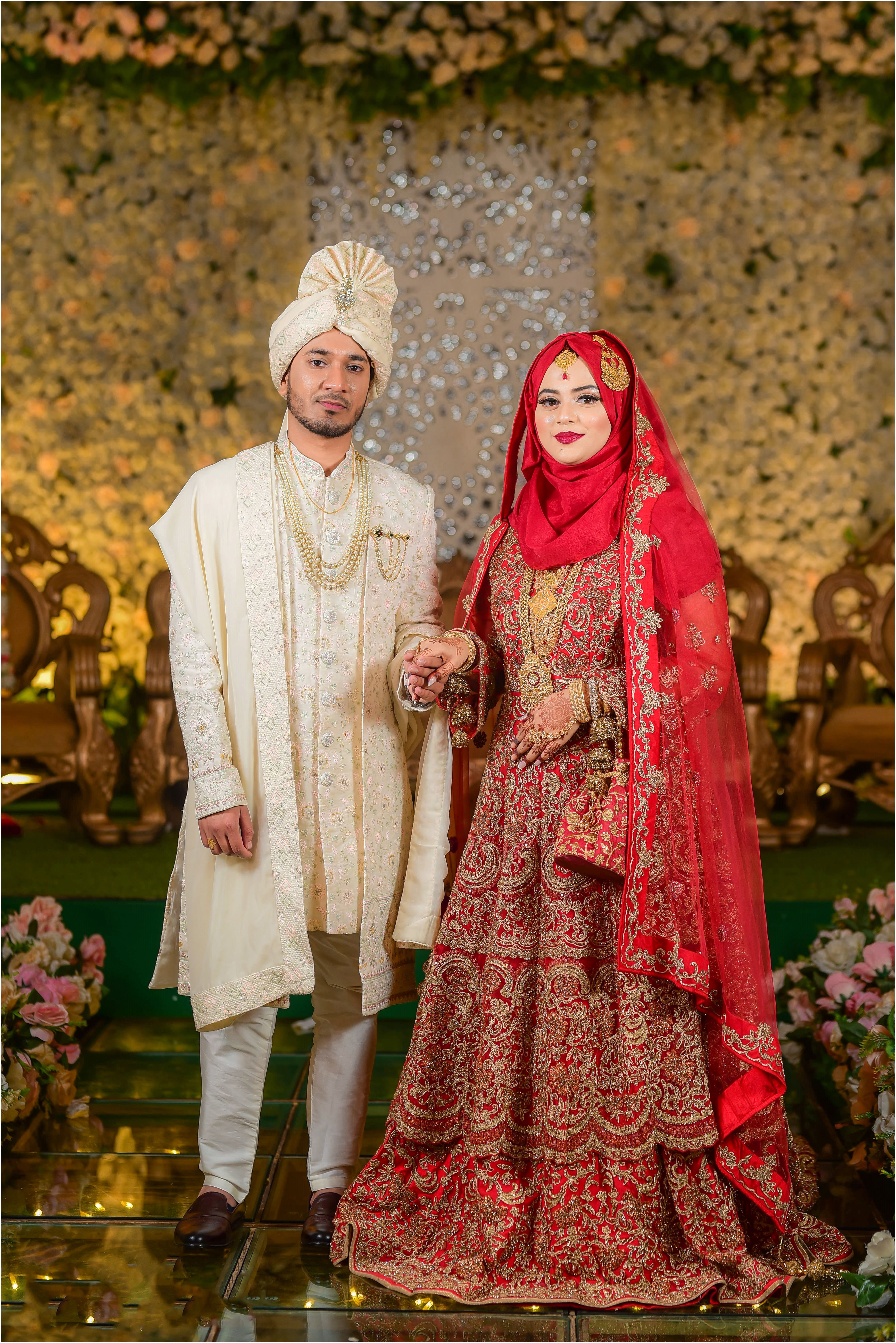 Newlyweds Standing in Traditional Clothing · Free Stock Photo