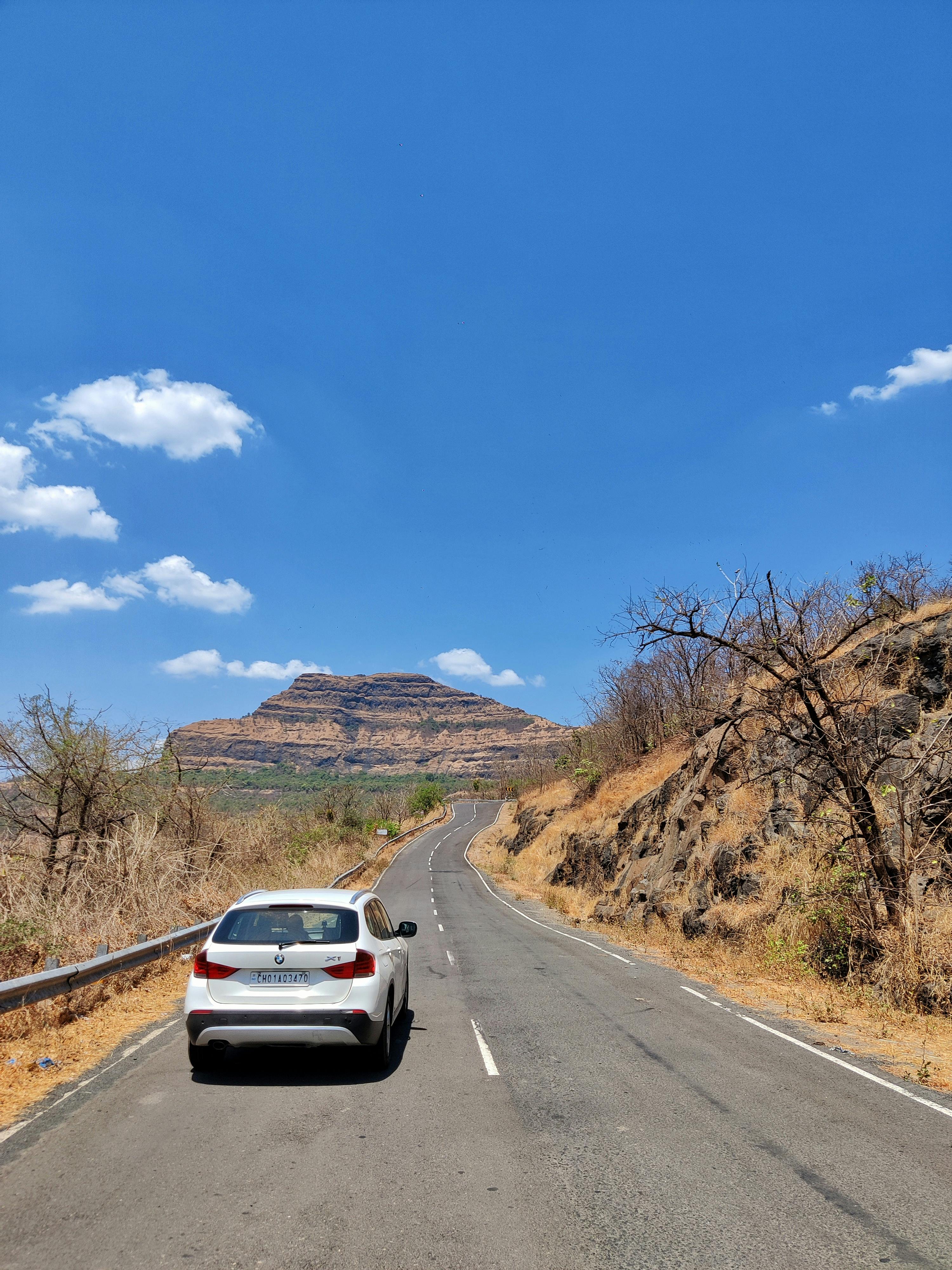 Car on Road through Dessert · Free Stock Photo