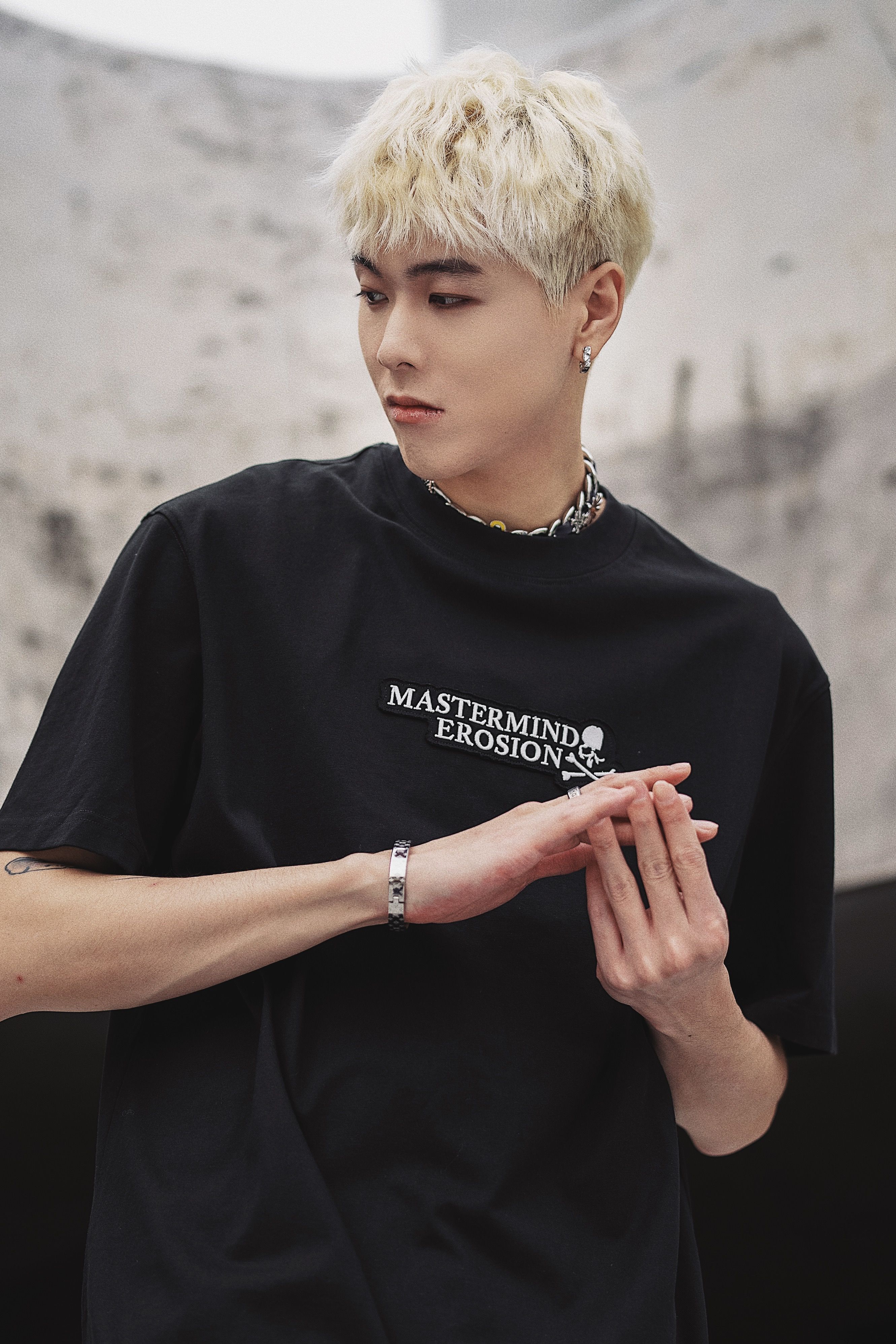 Young Man with Dyed Platinum Blond Hair Posing in Studio · Free Stock Photo