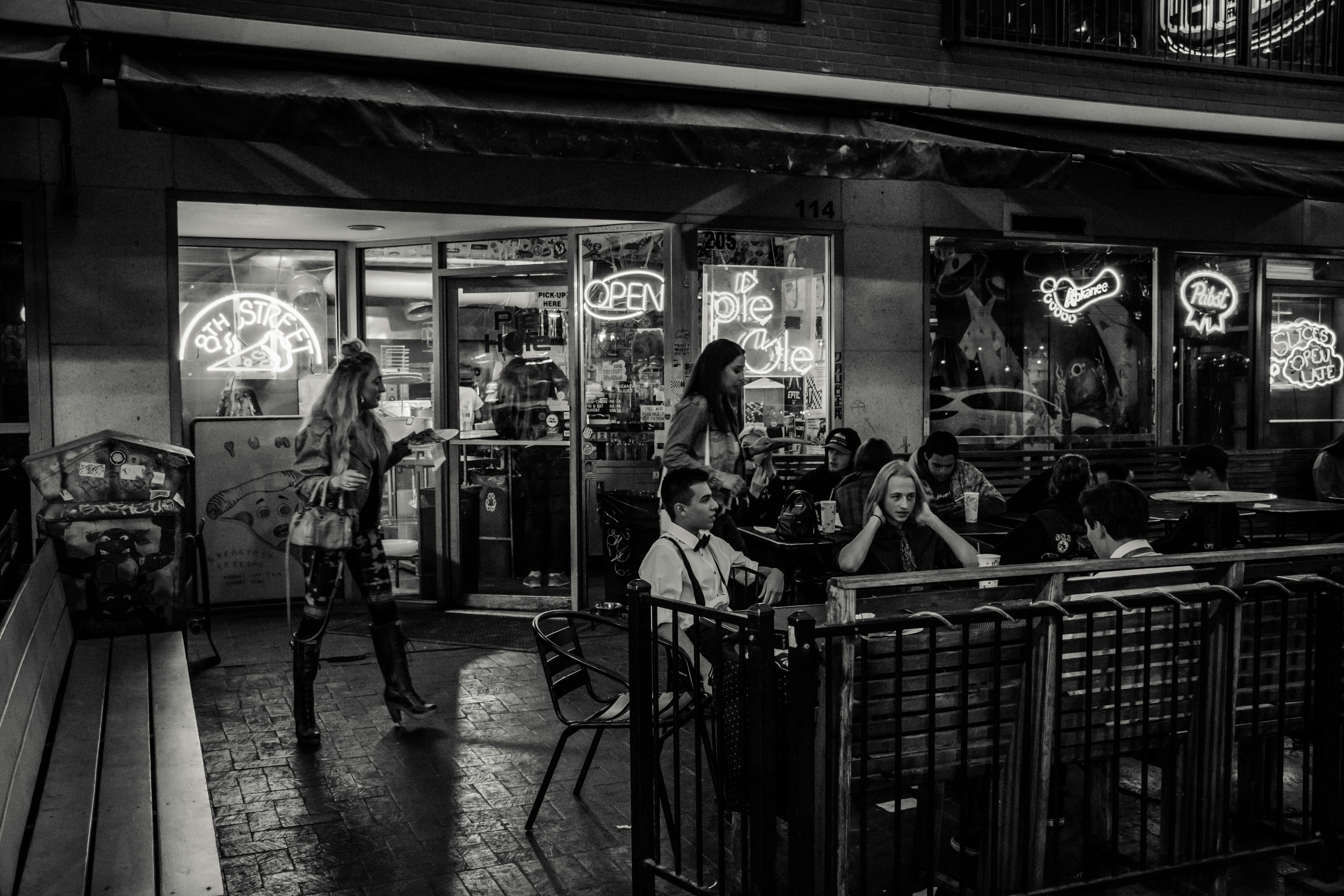 Grayscale Photography of People Near Bar · Free Stock Photo