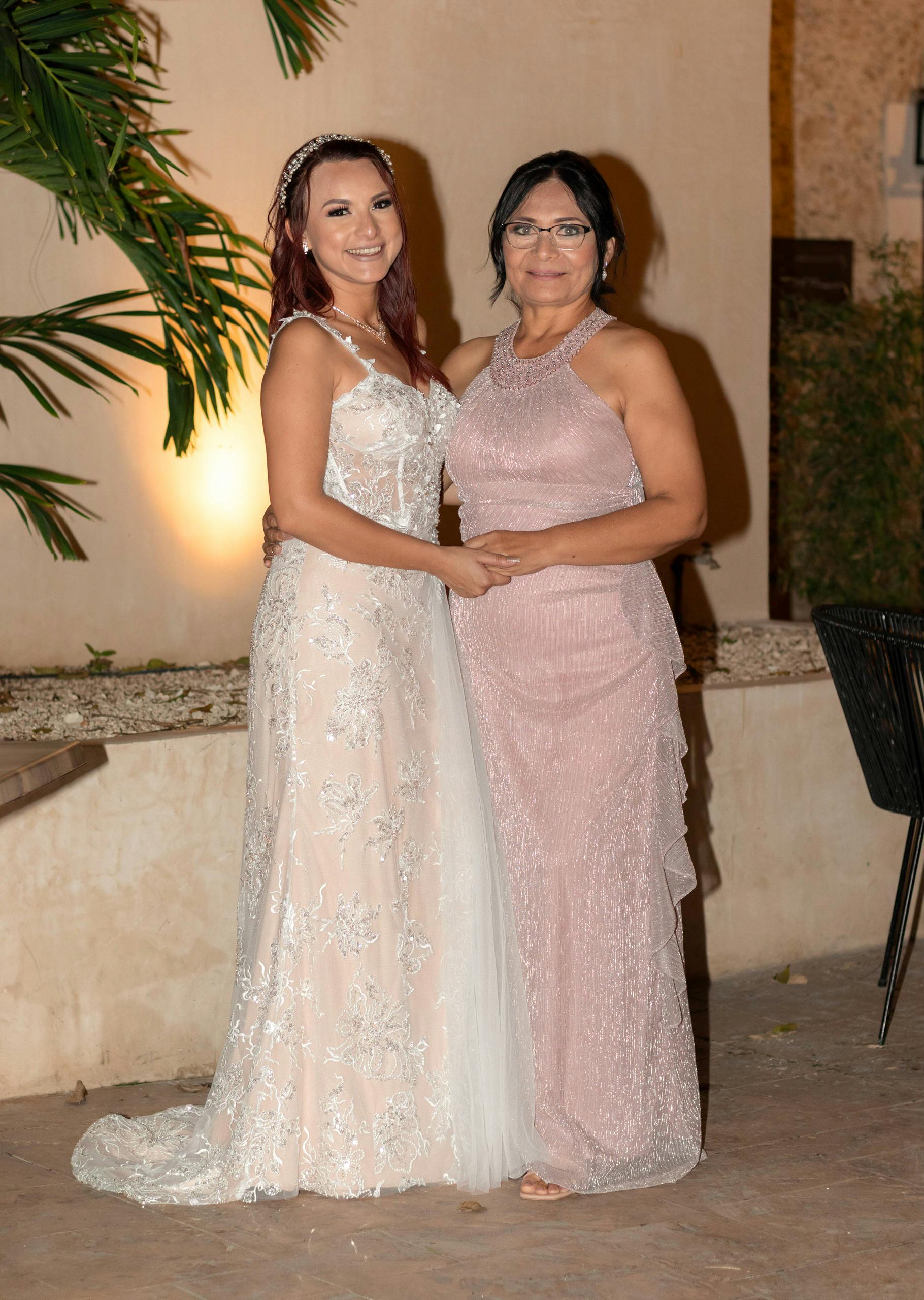 Smiling Bride Posing with a Wedding Guest · Free Stock Photo
