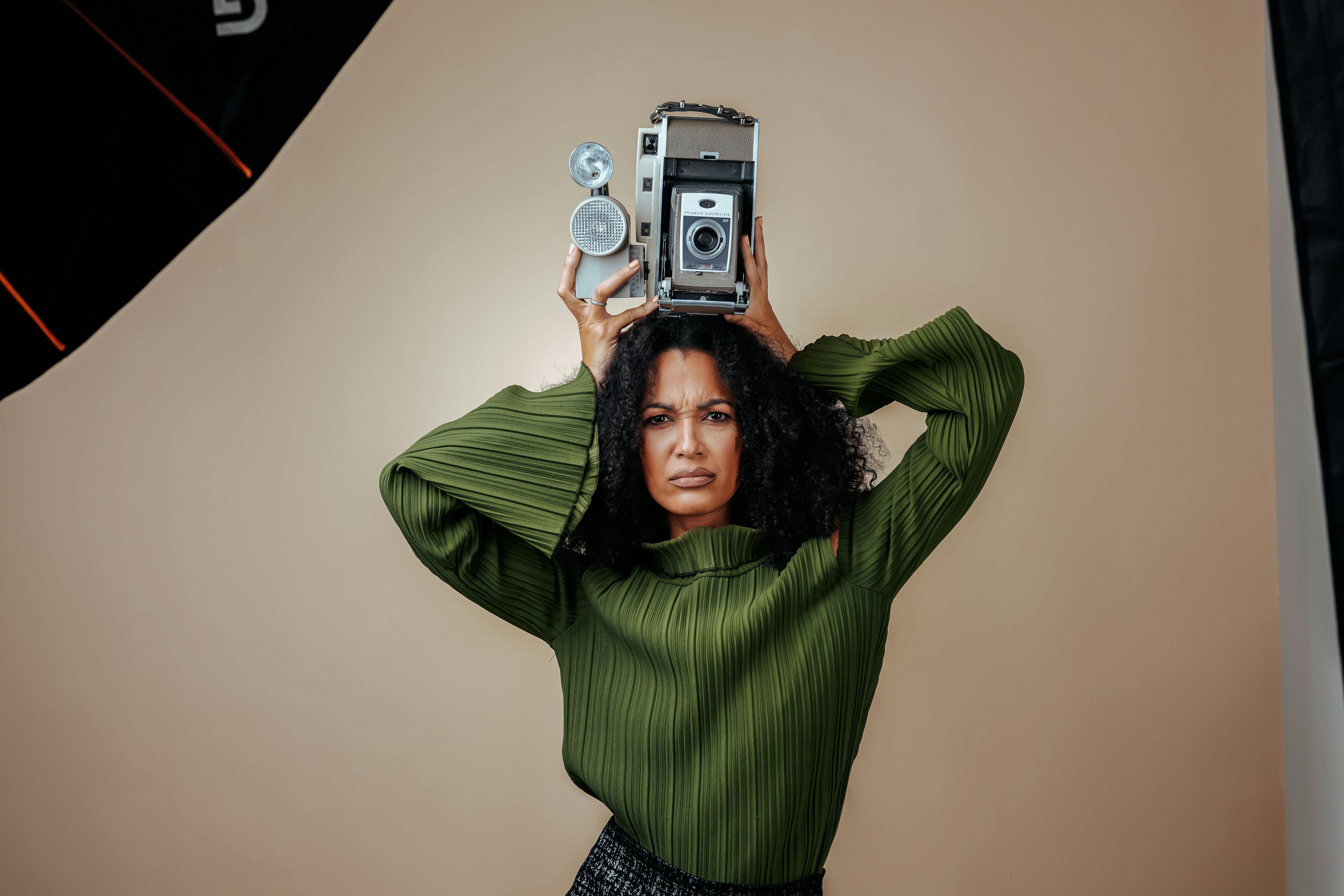 Woman Holding Camera · Free Stock Photo