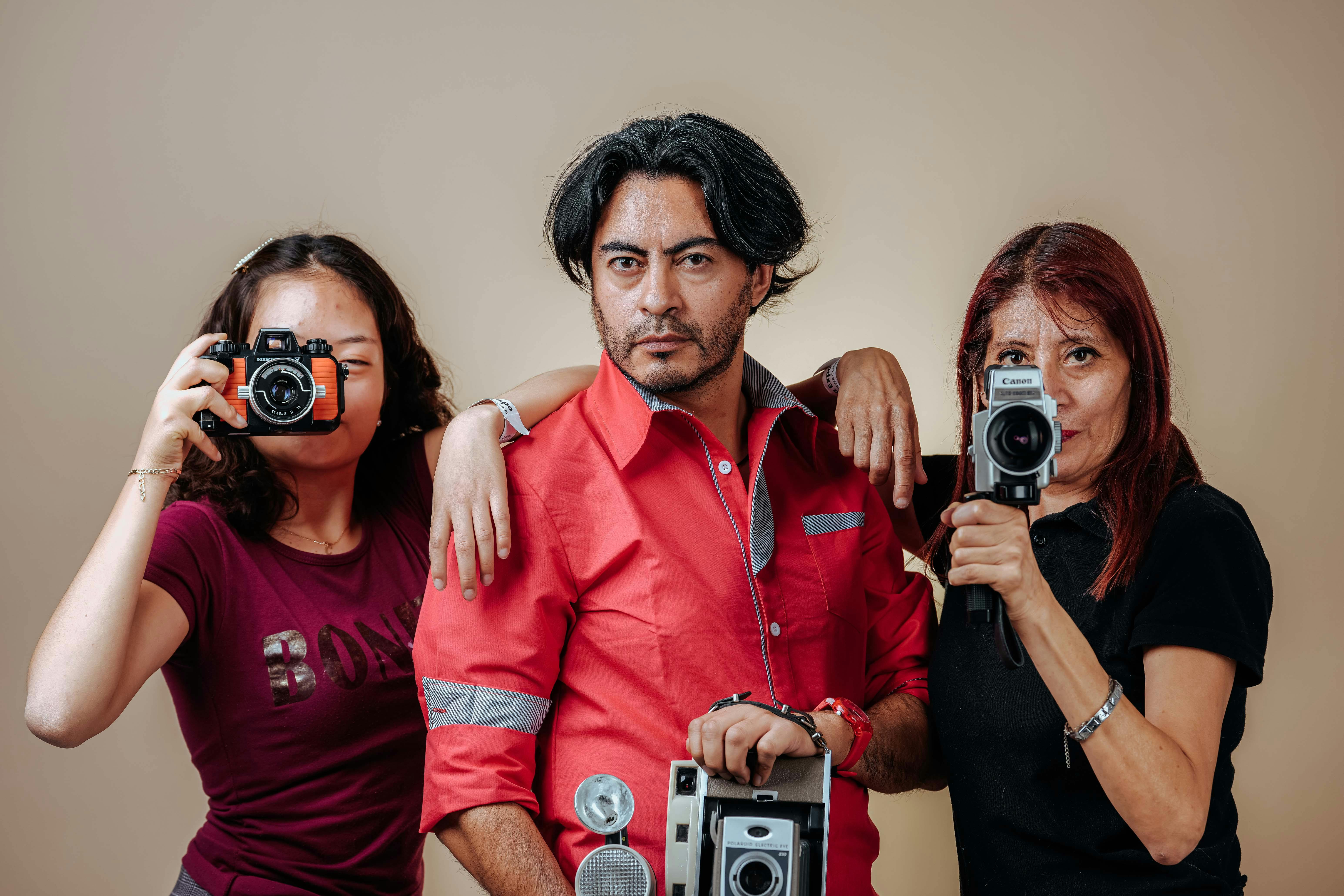 Photo of a Family with Retro Cameras · Free Stock Photo
