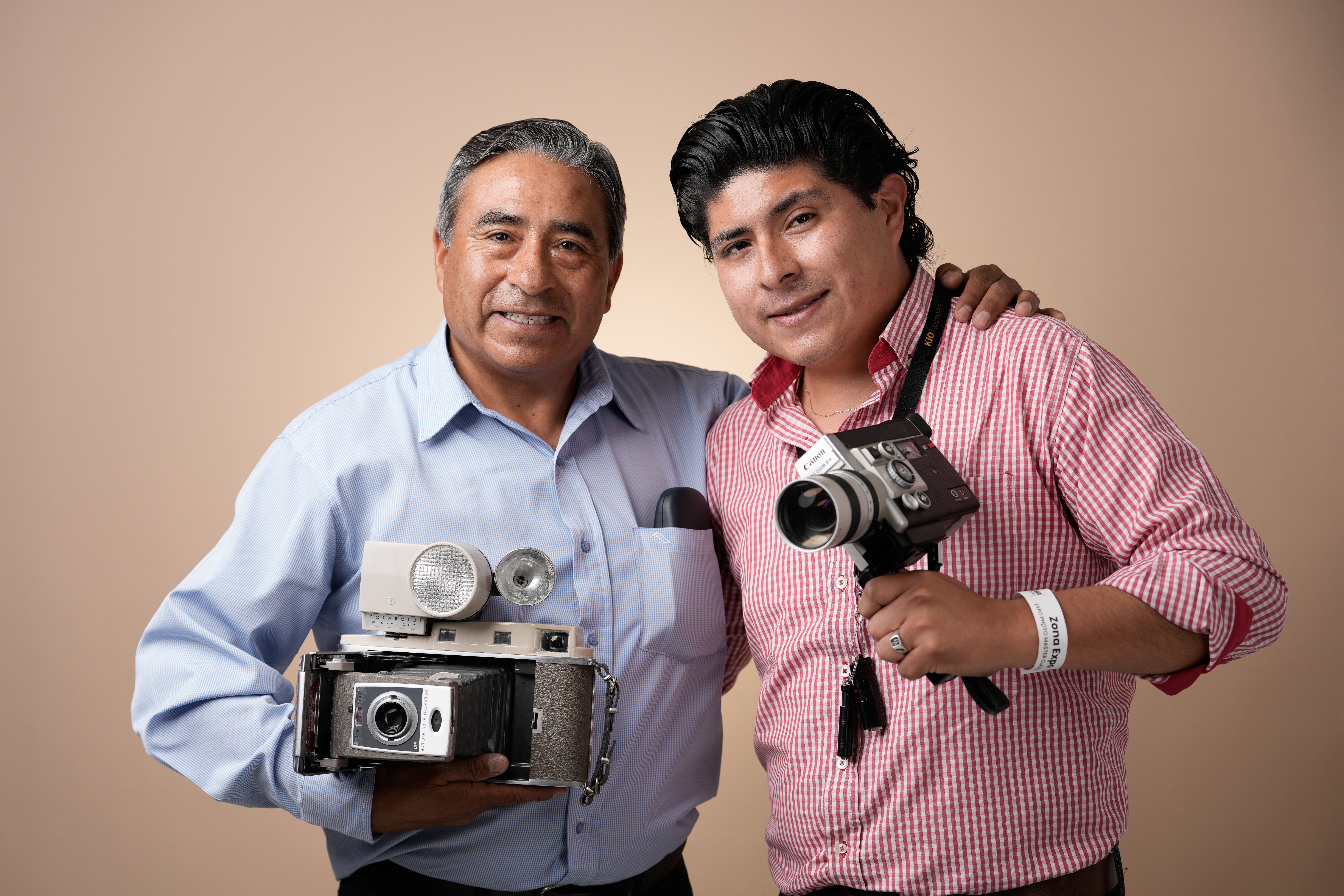 Men Posing with Cameras · Free Stock Photo