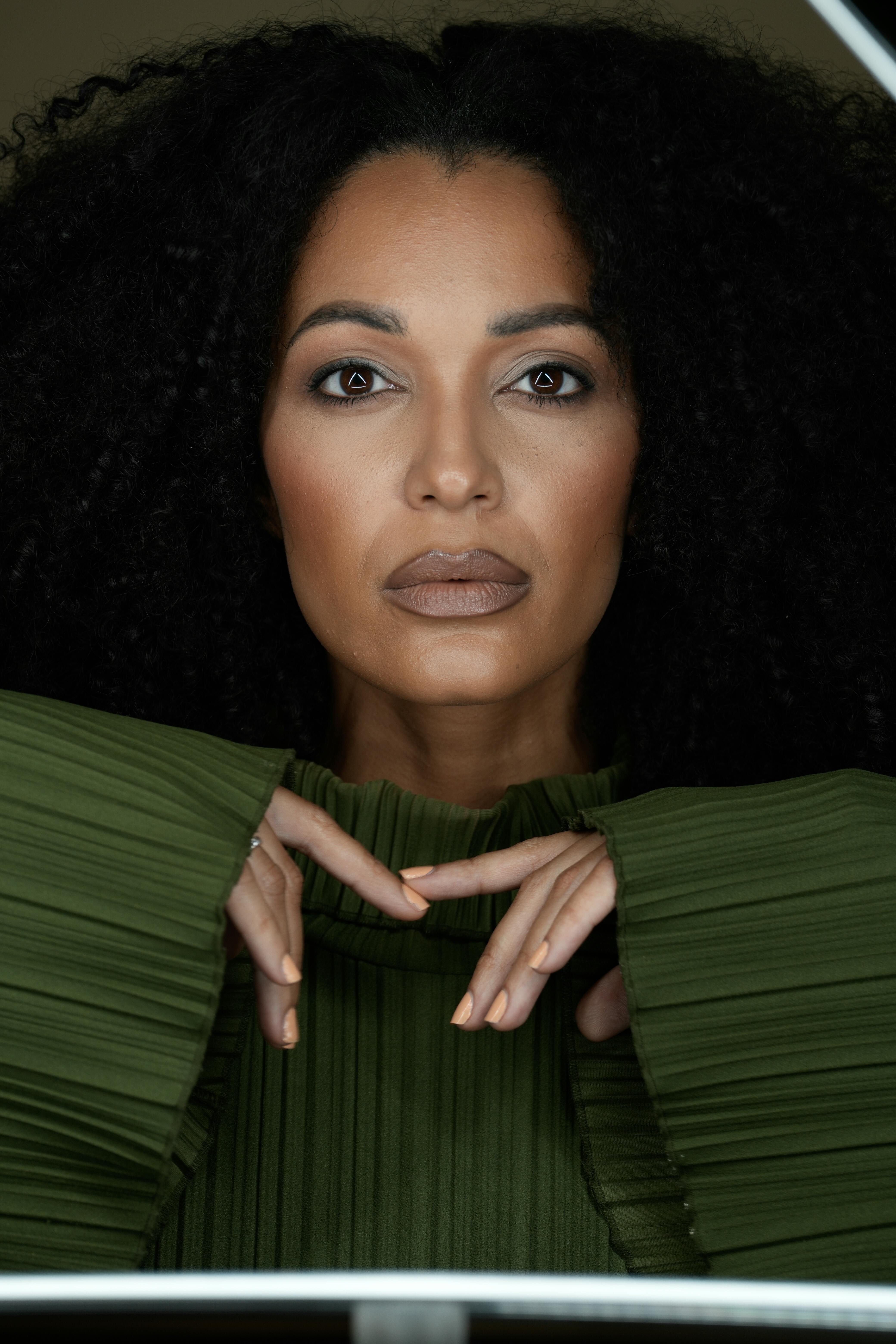 Model Standing in Multi Colored Dress against Red Background · Free ...