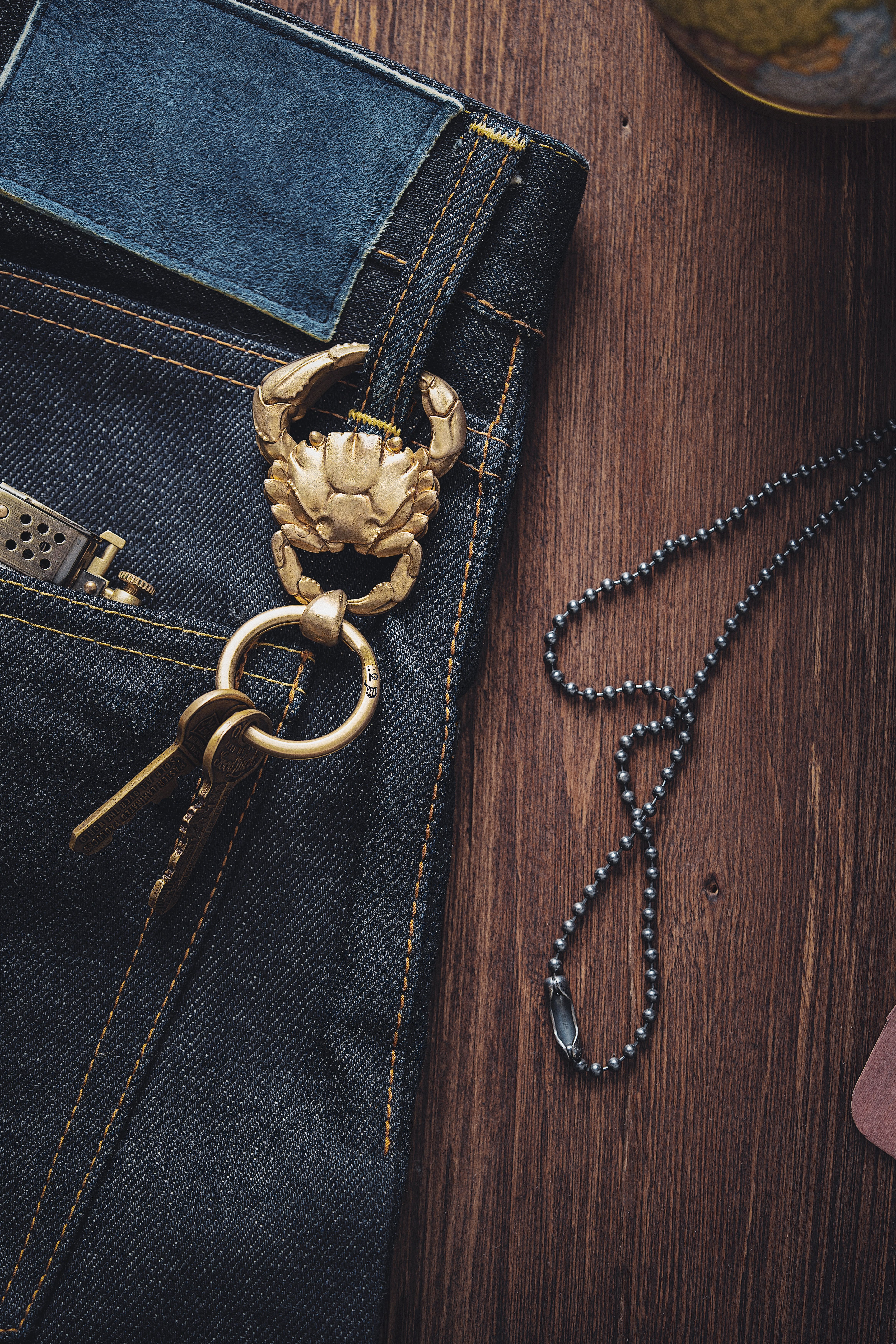 Golden Crab Keychain on Jeans · Free Stock Photo