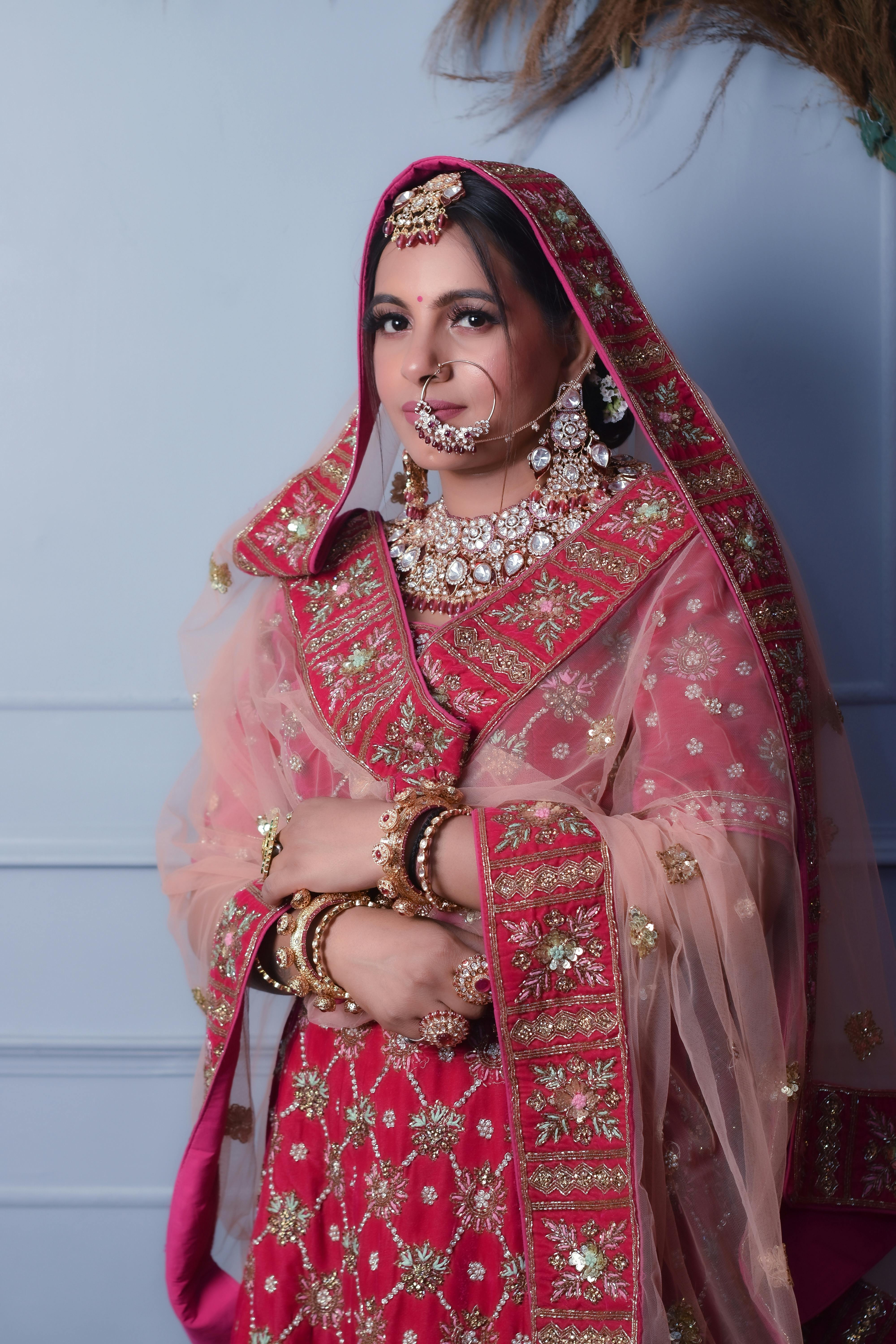 Bride Wearing Ornate Red Sari and Jewellery · Free Stock Photo