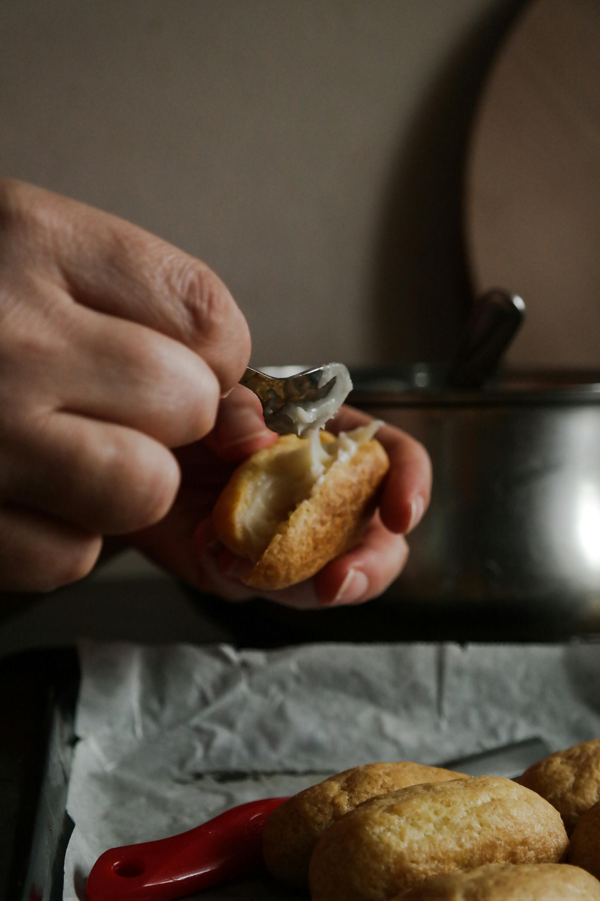 Close-up of Man Putting Cream into Puffs · Free Stock Photo
