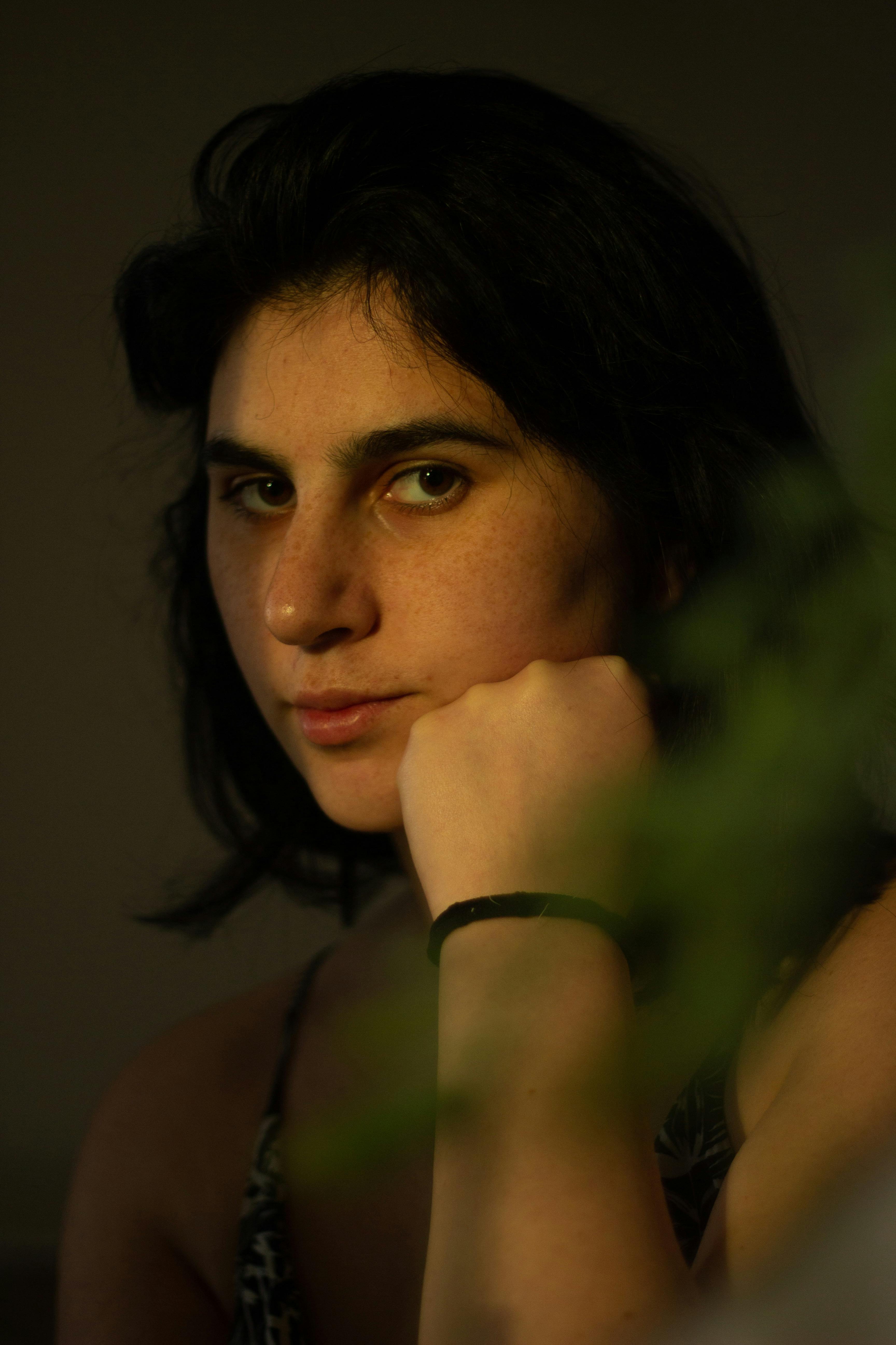 Portrait of a Woman Leaning on her Hand · Free Stock Photo