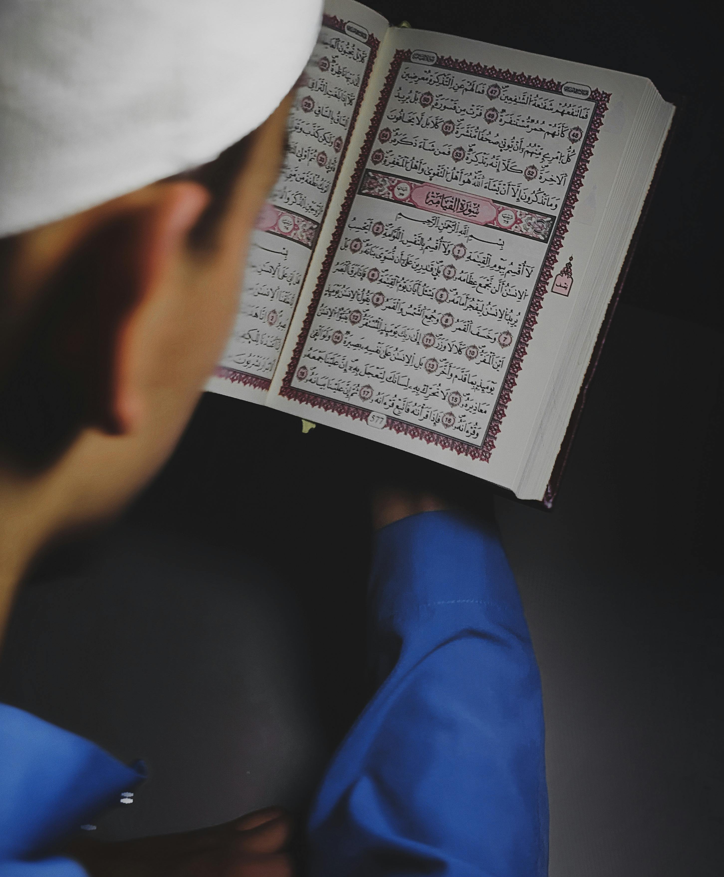Photo of a Man Reading Koran · Free Stock Photo