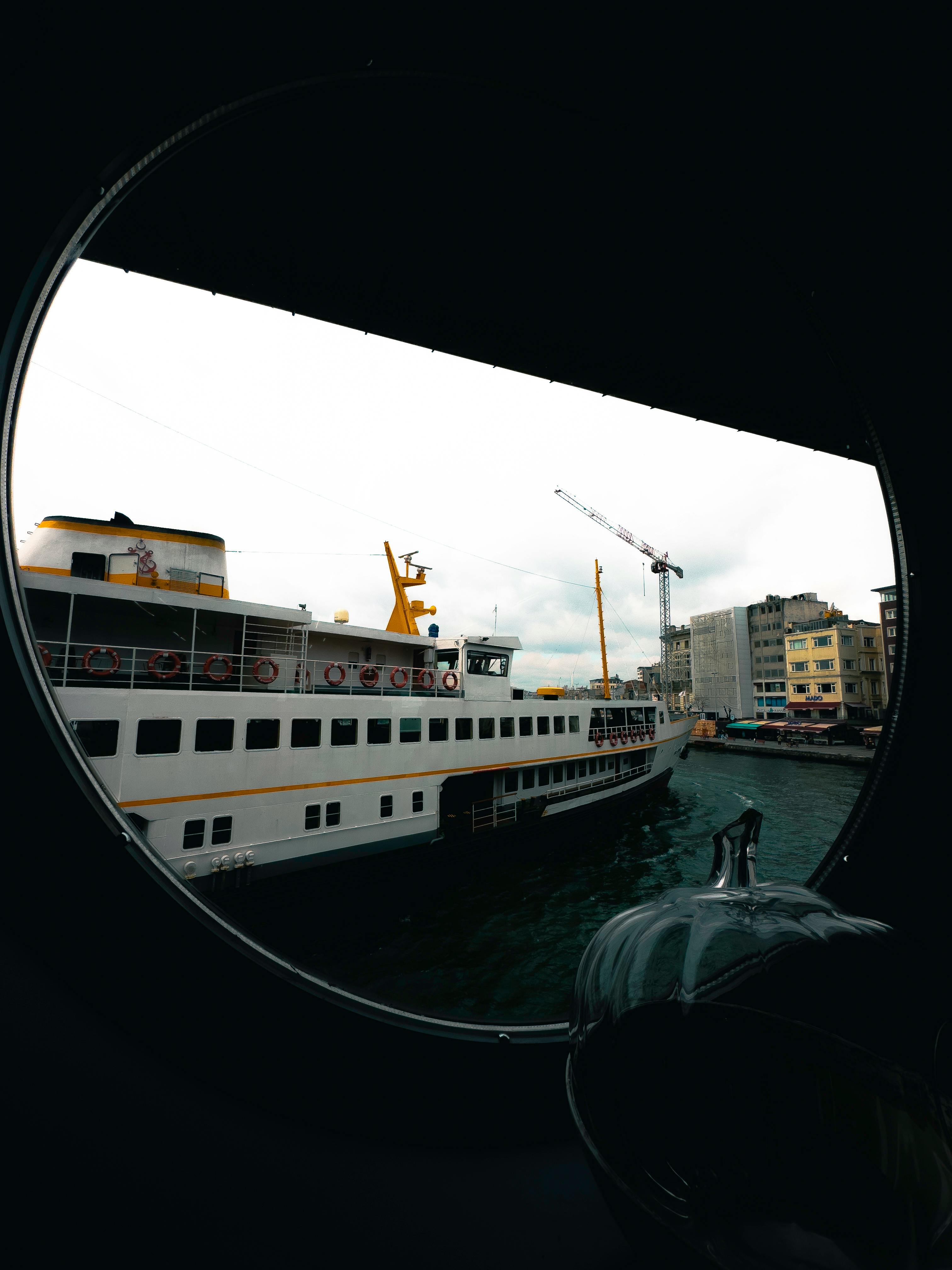 Ferry Seen from a Round Ship Window · Free Stock Photo