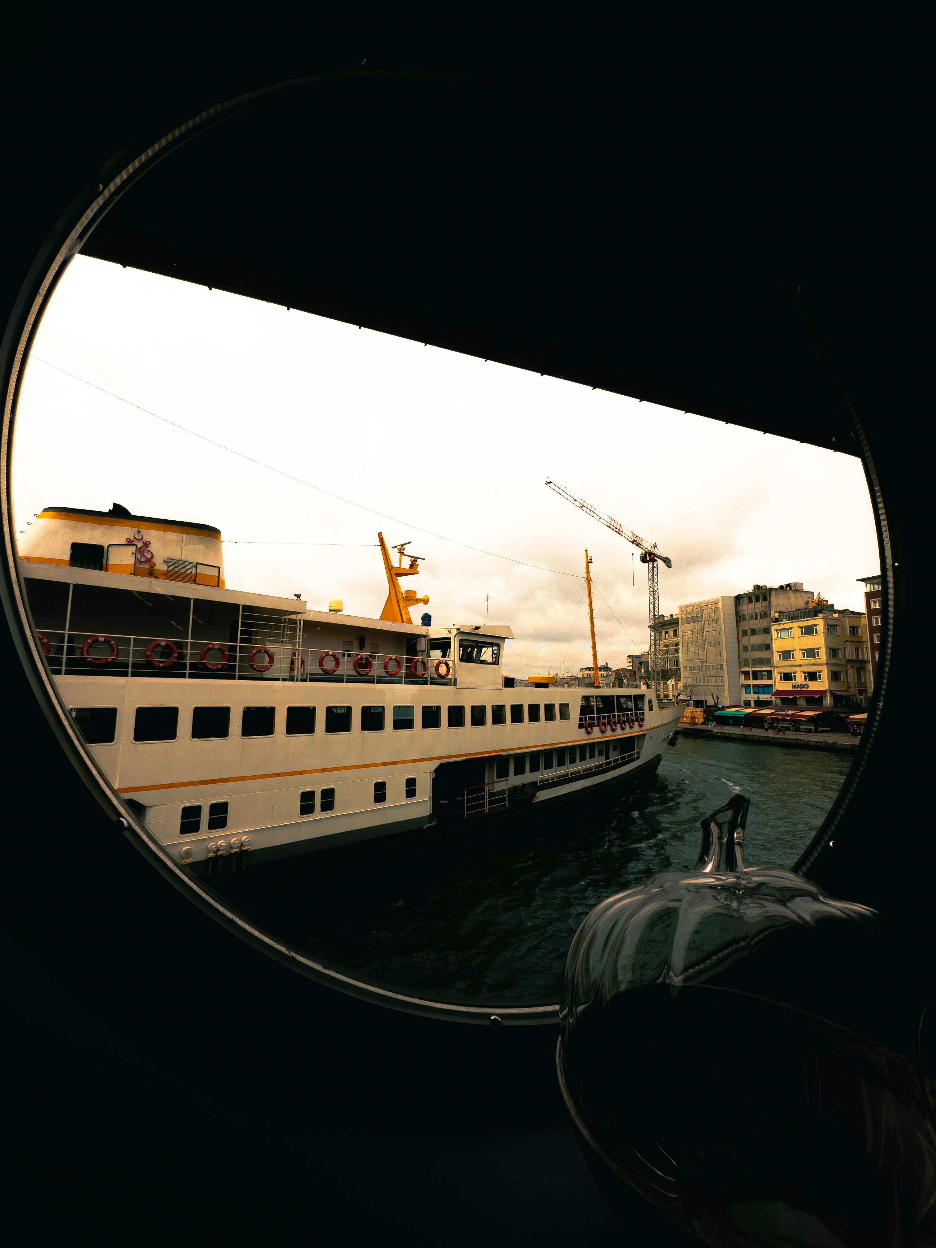 Ferry Seen through Round Boats Window · Free Stock Photo