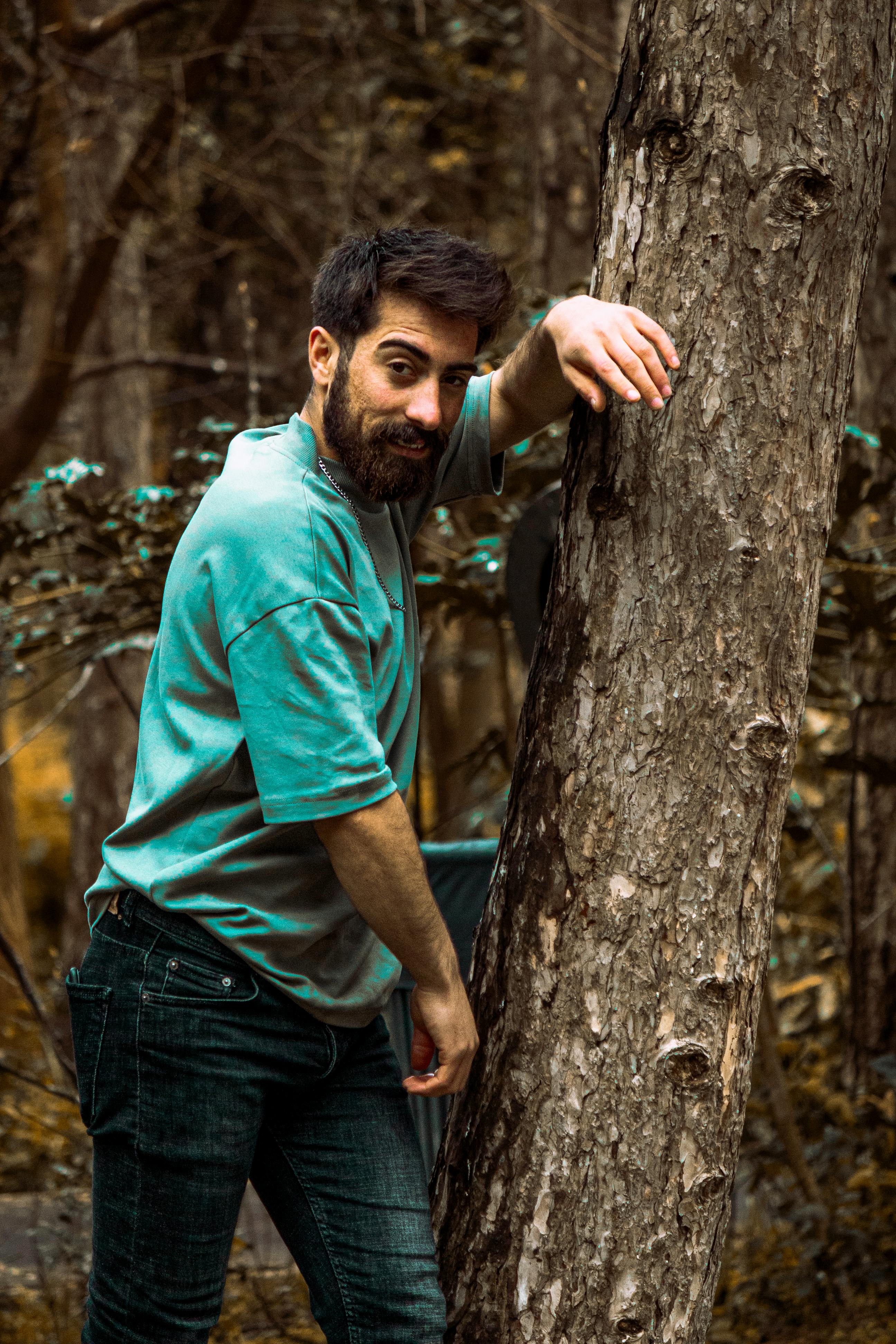 Portrait of a Man Standing by a Tree · Free Stock Photo