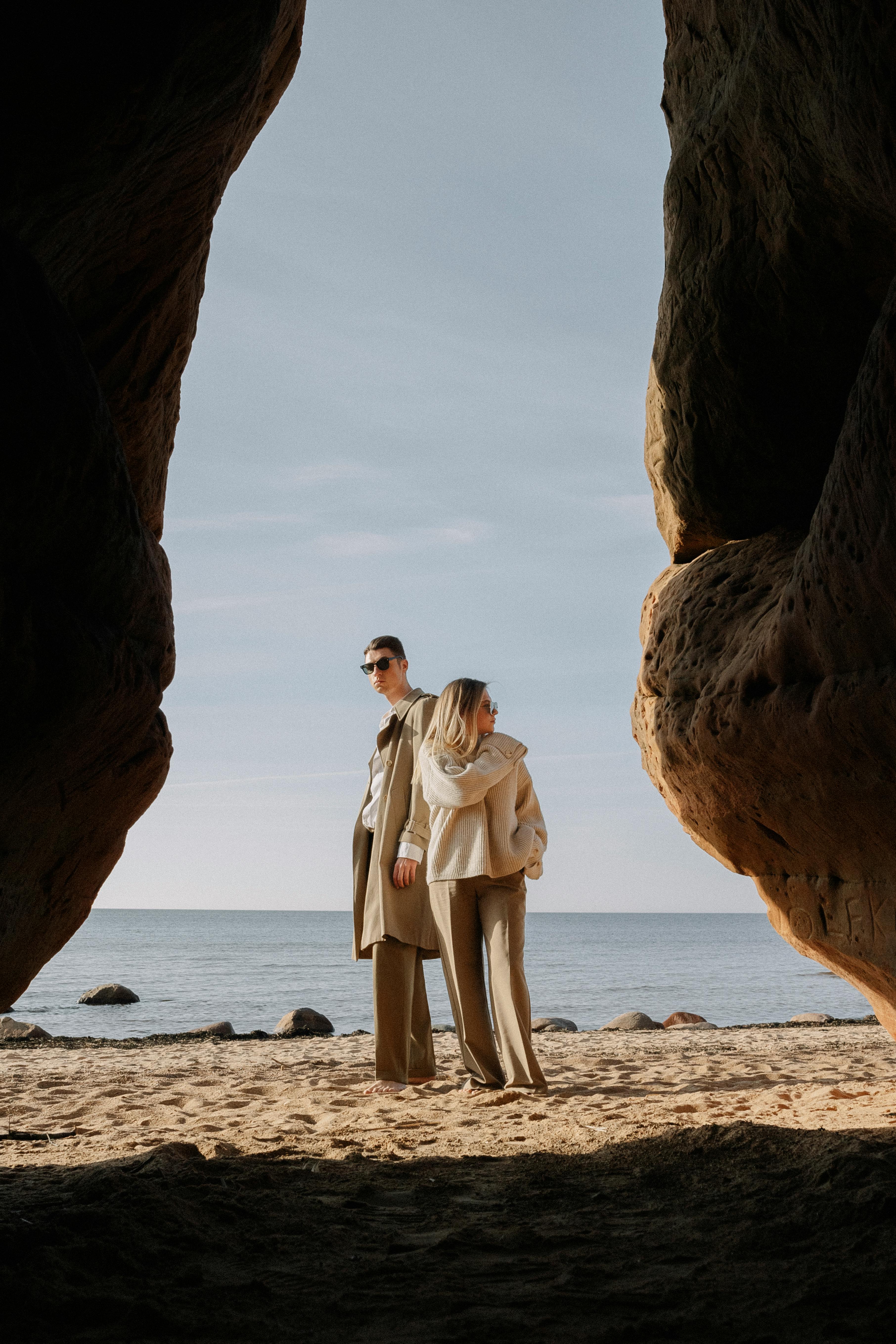 Two Fashion Models Posing on a Beach · Free Stock Photo