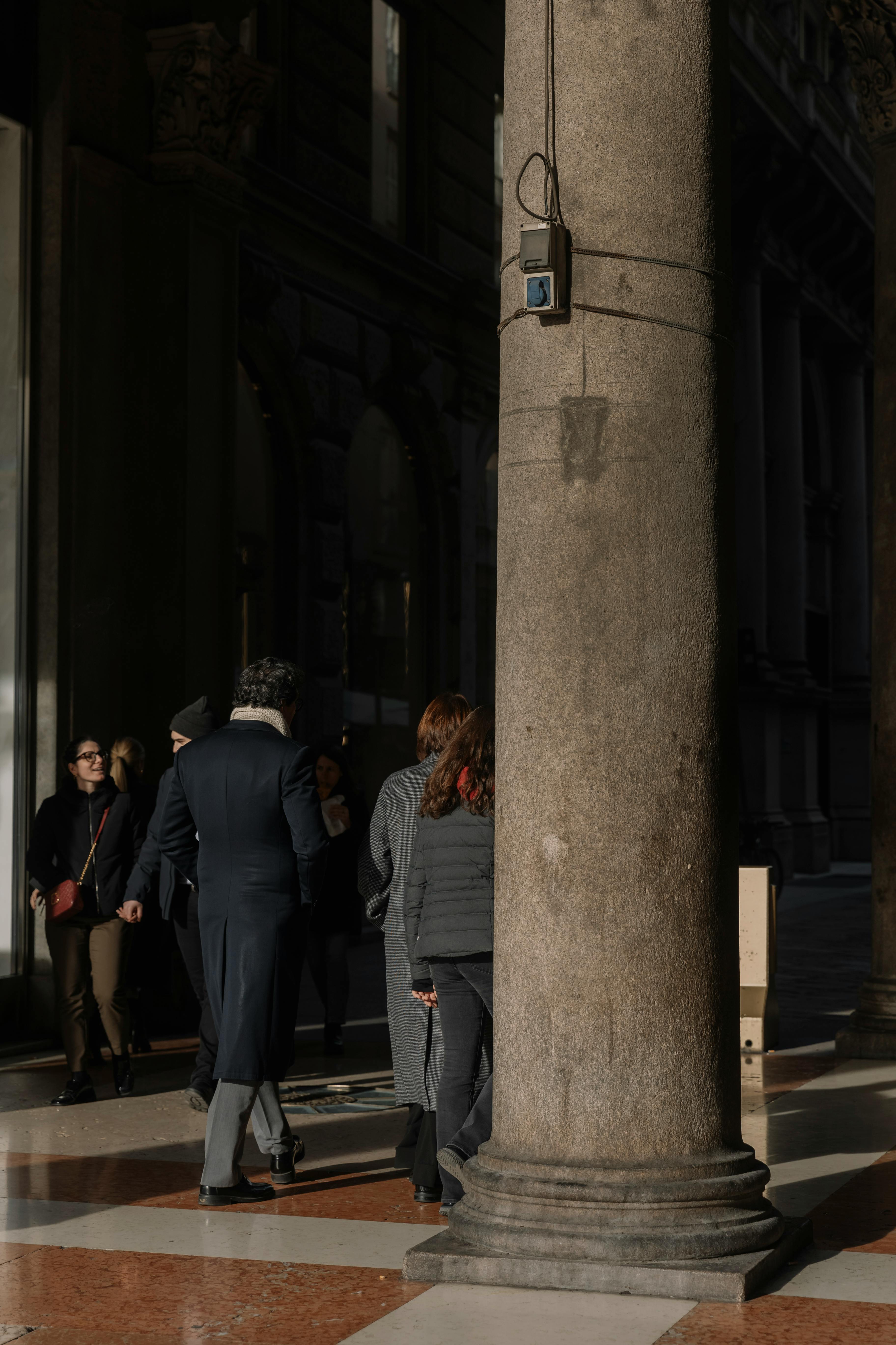People Walking near Column · Free Stock Photo