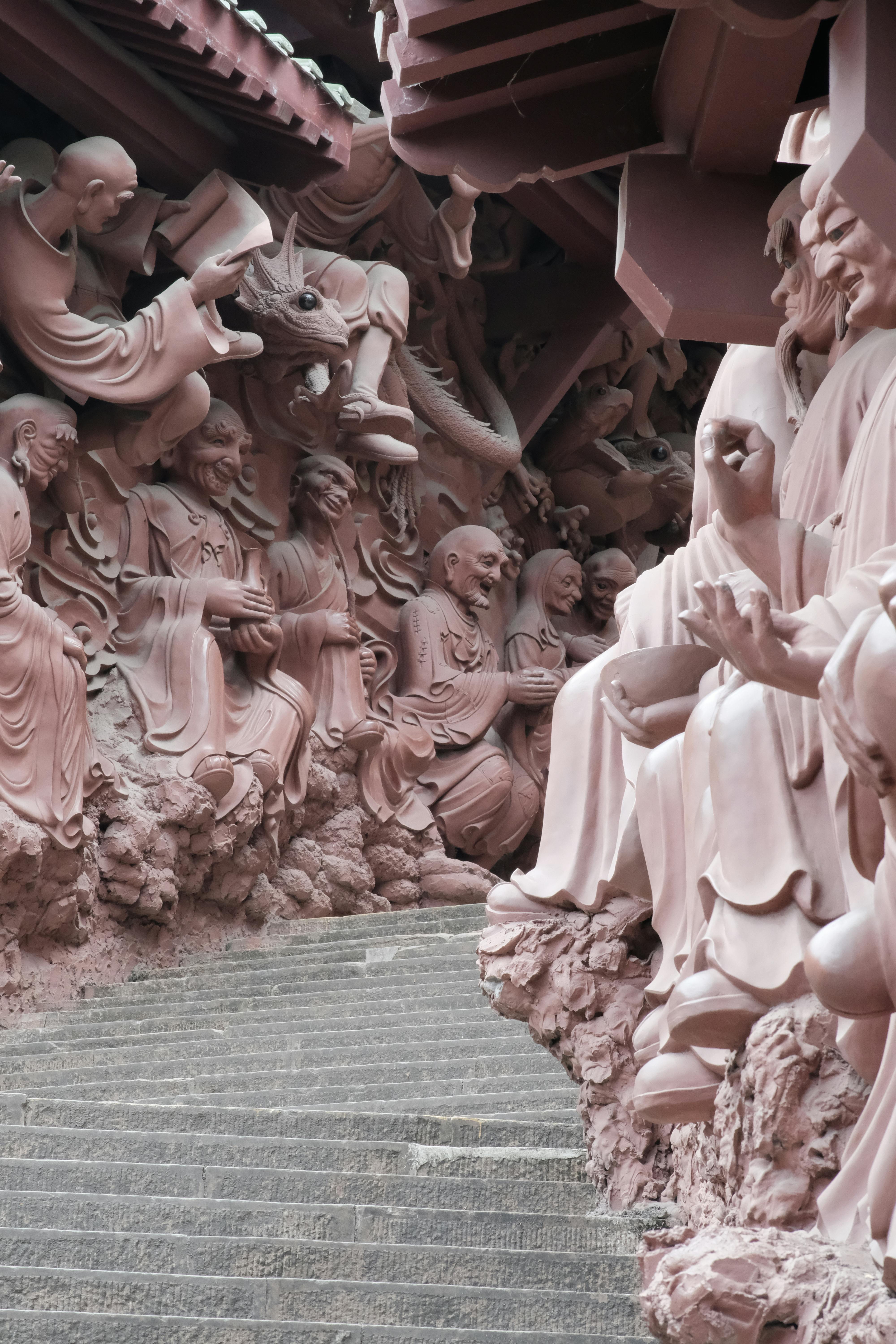 Steps and Carved Sculptures of Monks · Free Stock Photo