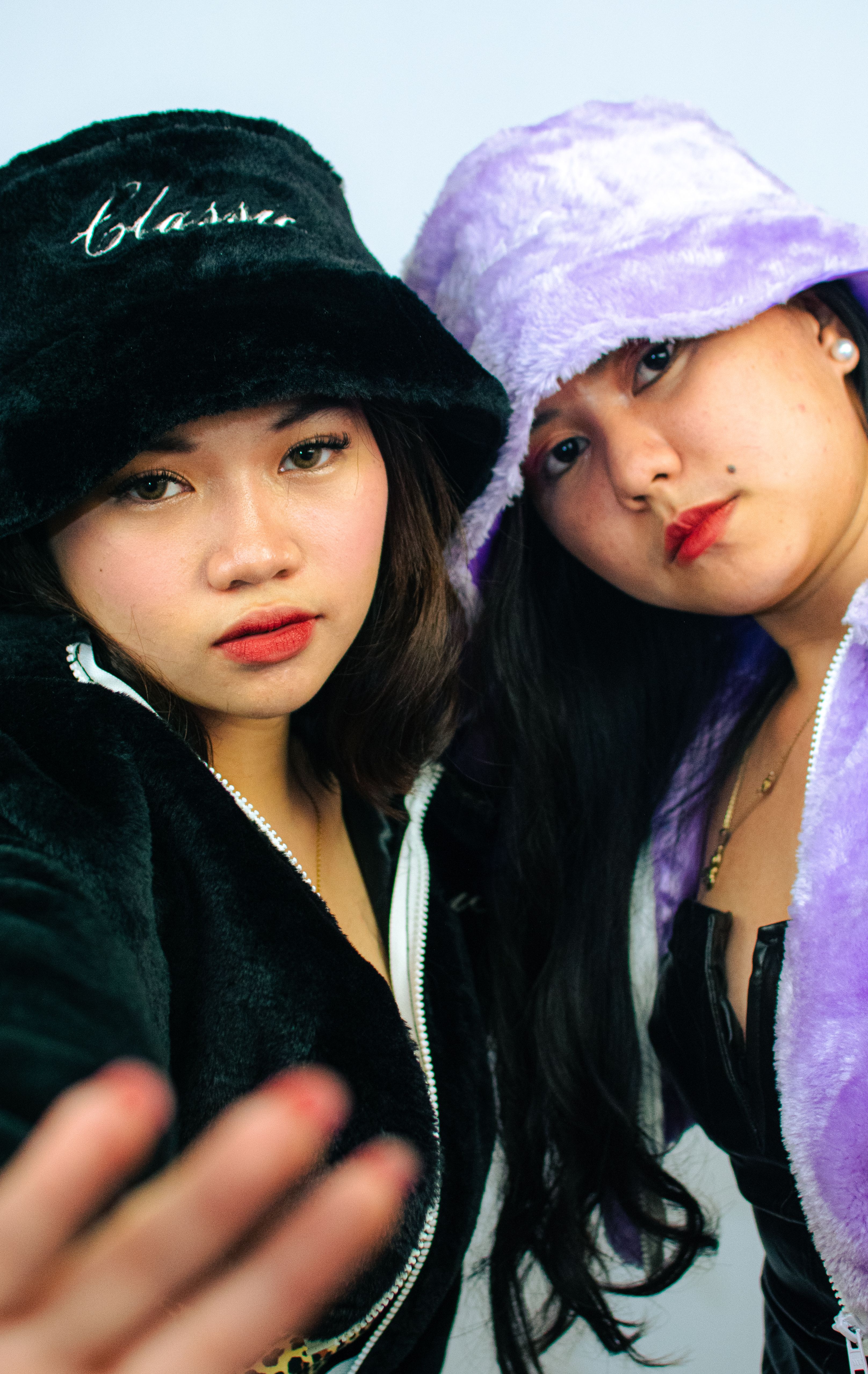 Young Women with Hats Posing Together · Free Stock Photo