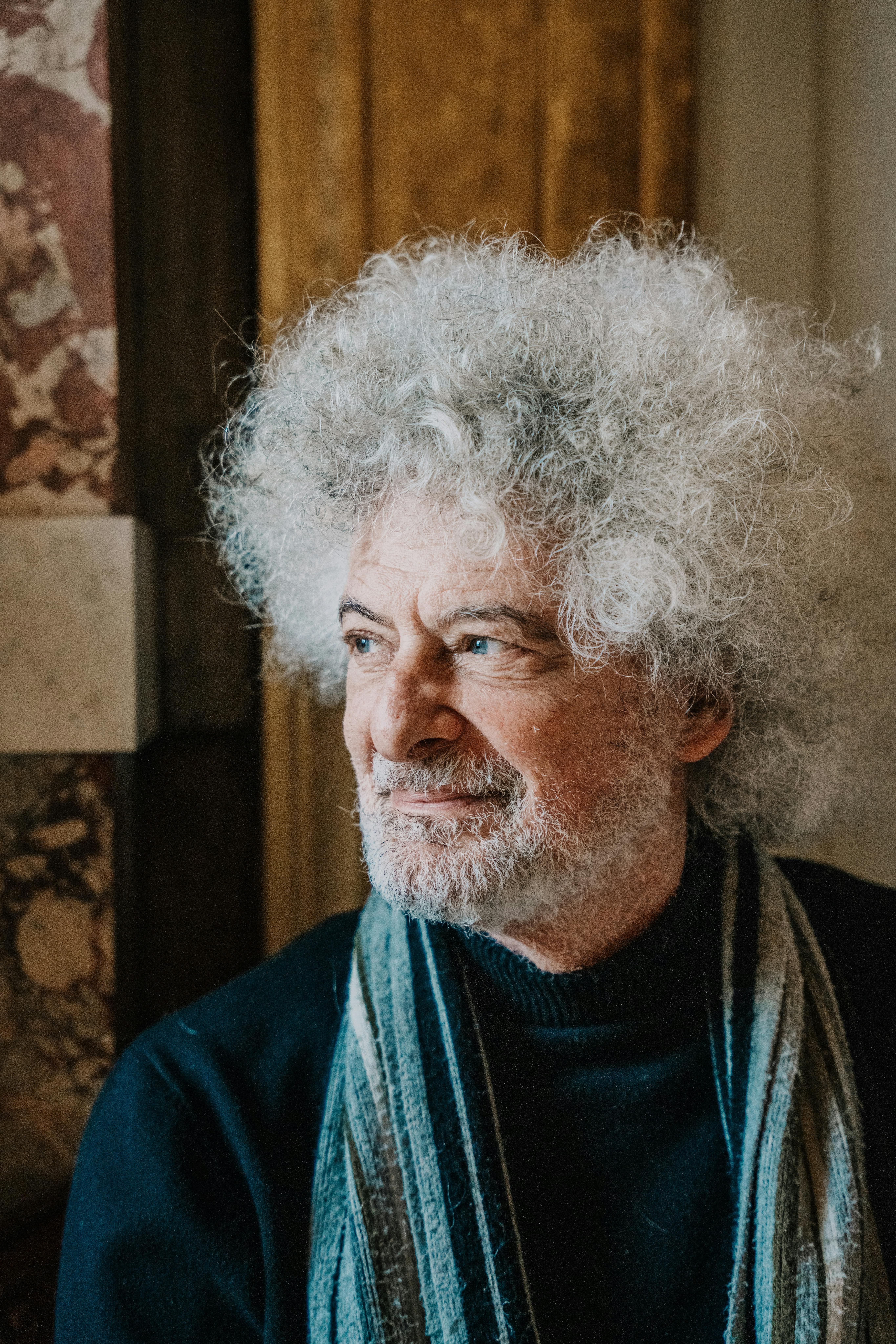 Man with Curly, Gray Hair · Free Stock Photo