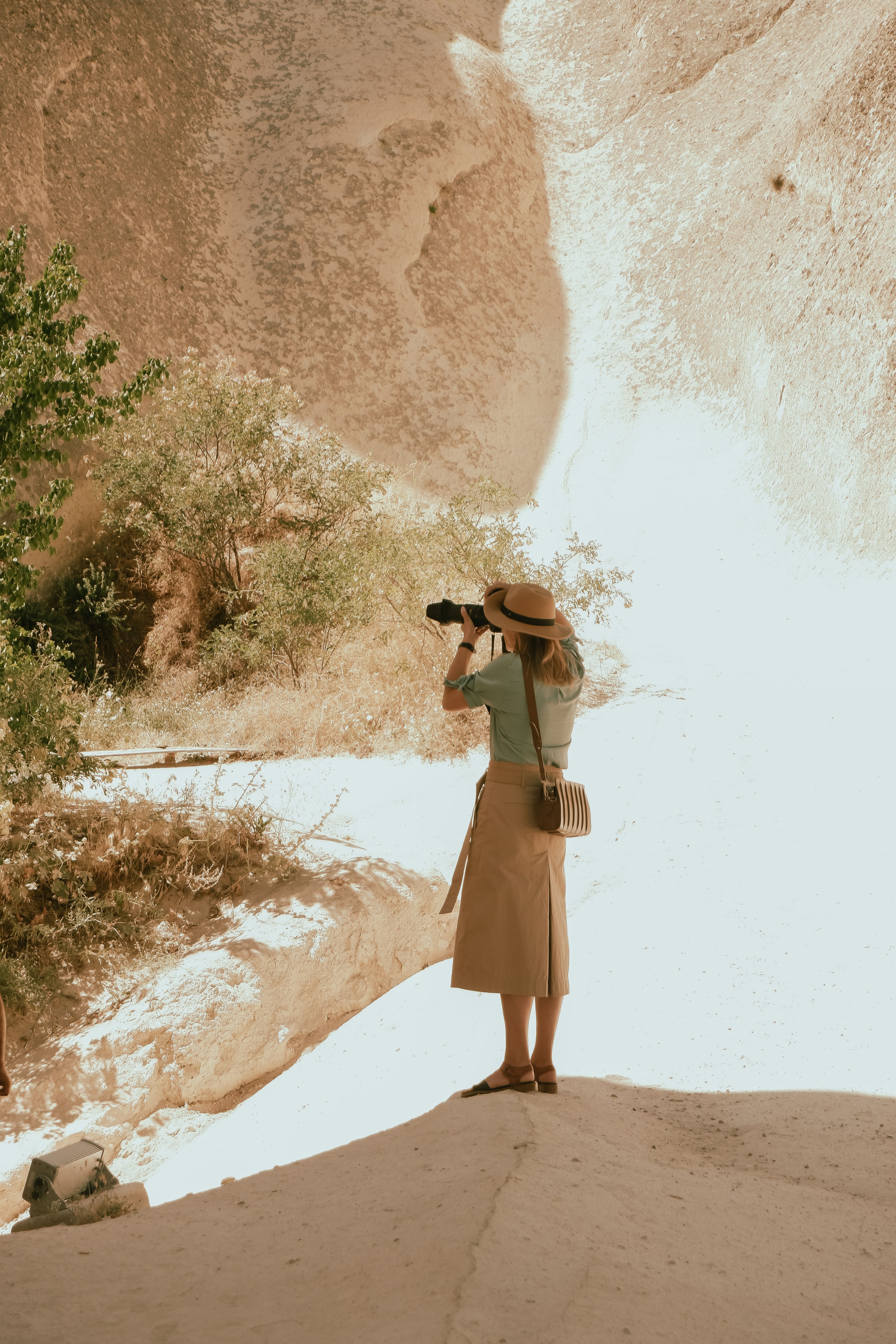 Woman Taking a Photo of a Rock Formation · Free Stock Photo