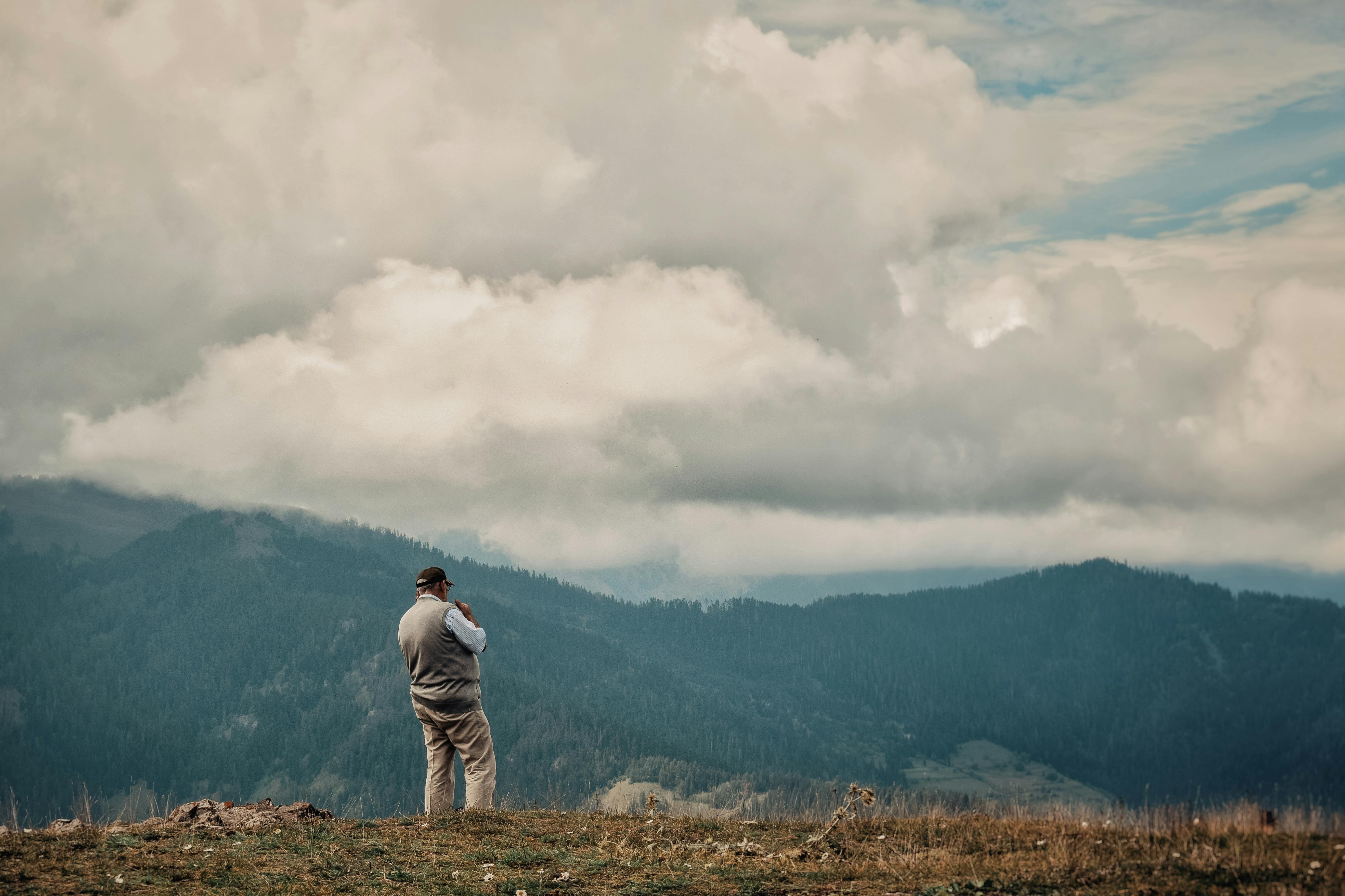 A Man Standing in the Middle of the Forest · Free Stock Photo