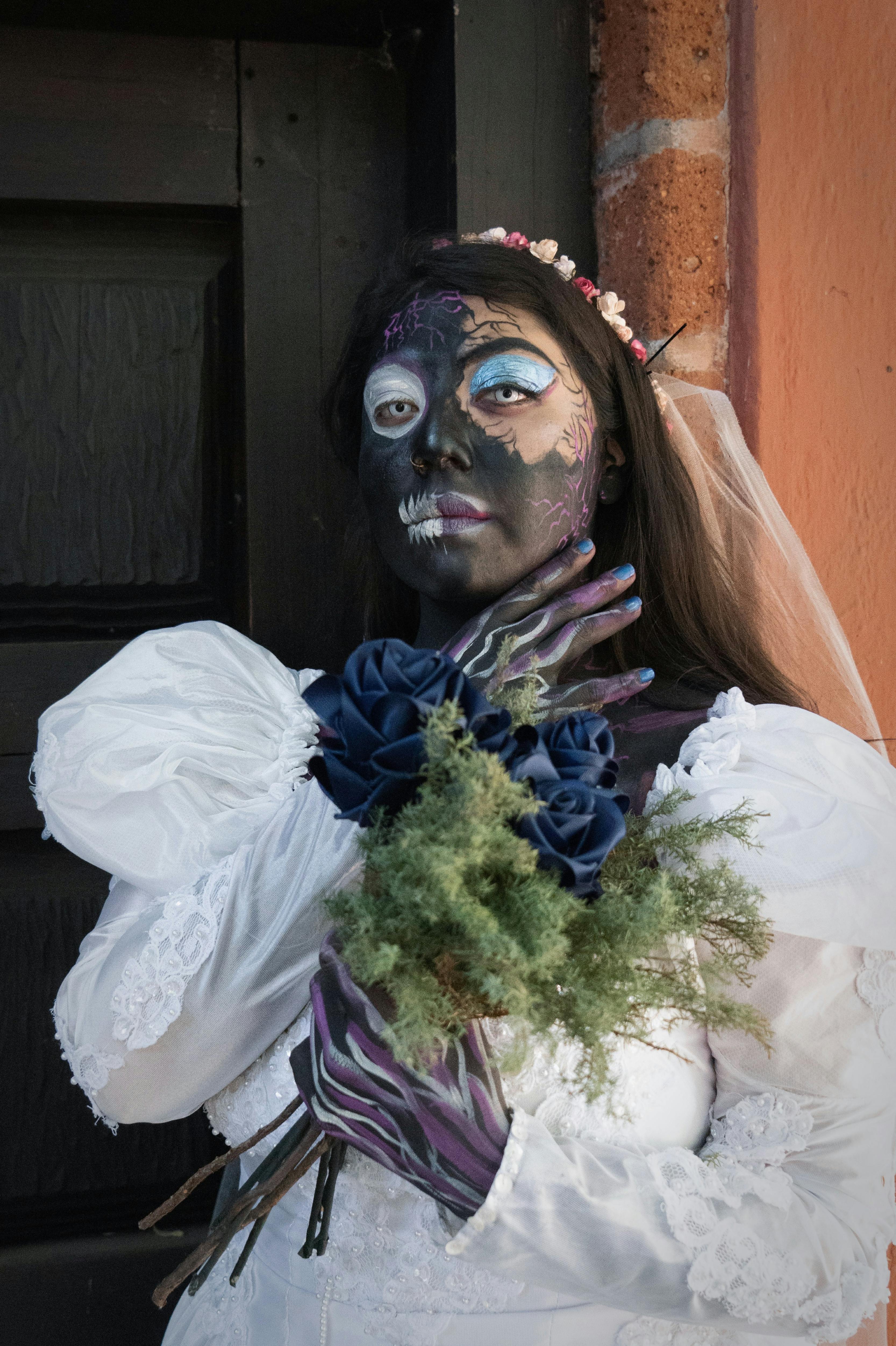 Portrait of Catrina with Painted Face and Flowers · Free Stock Photo