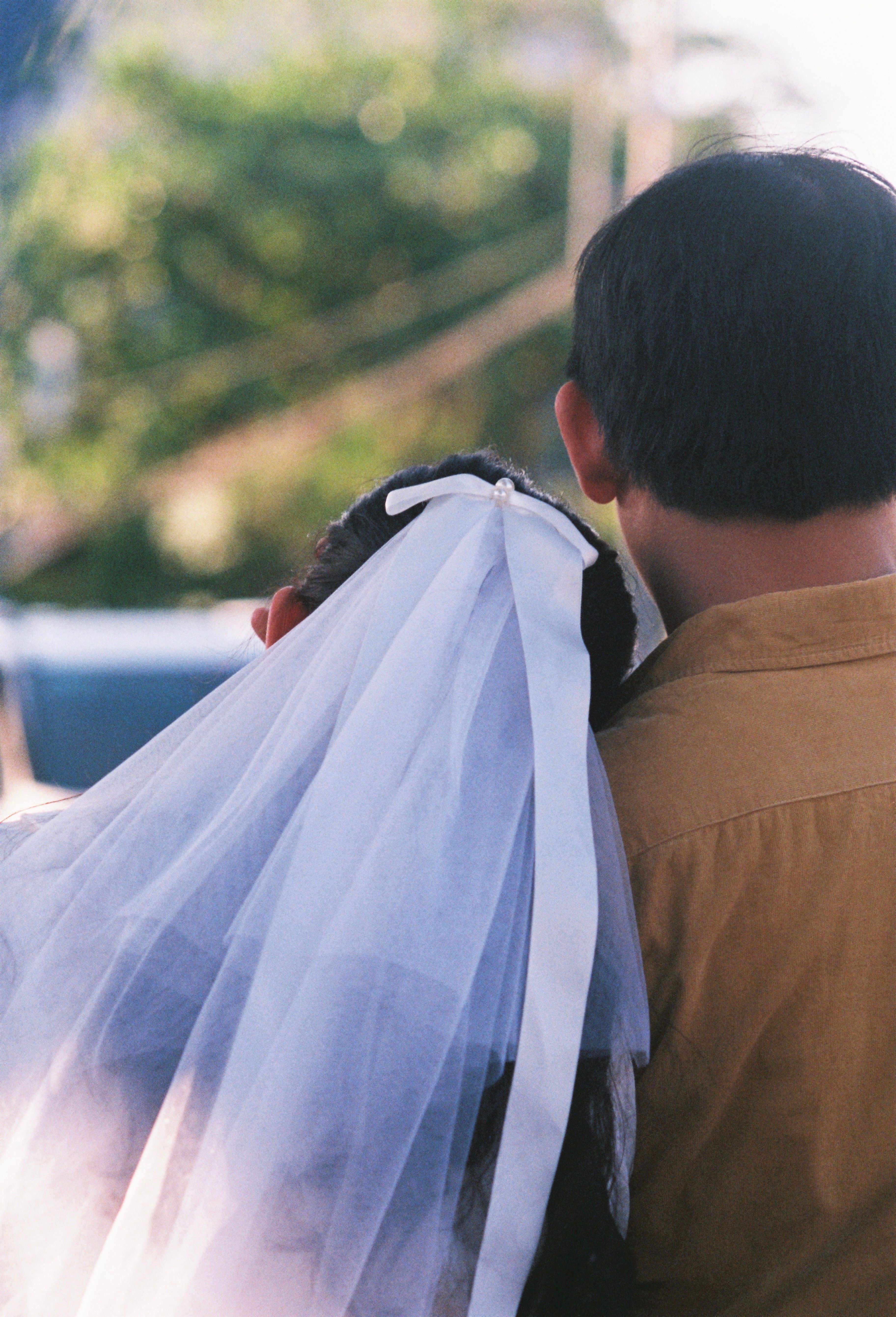 Romantic Wedding Embrace by a Serene Lake · Free Stock Photo