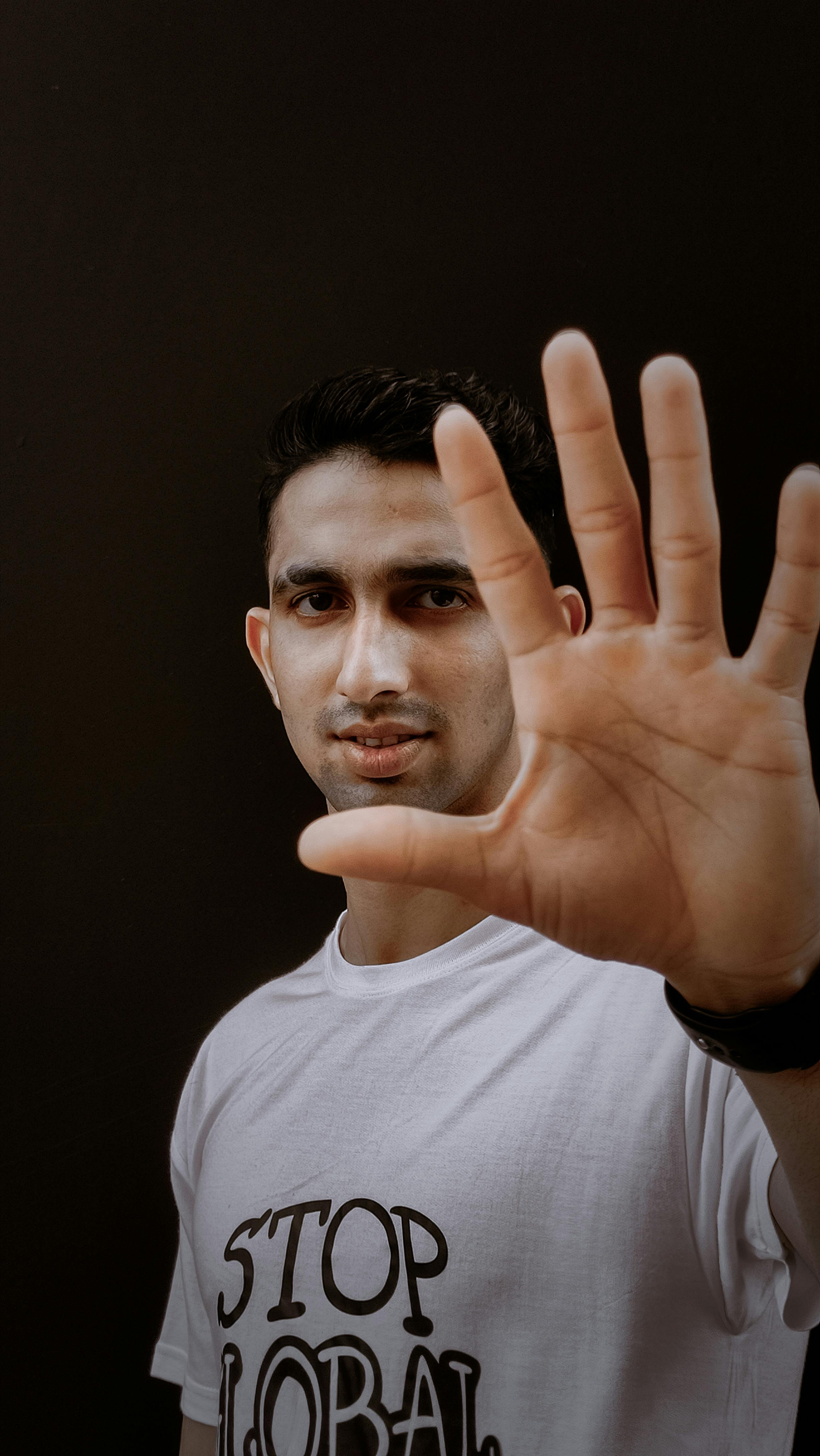 Man Posing with Hand Up · Free Stock Photo