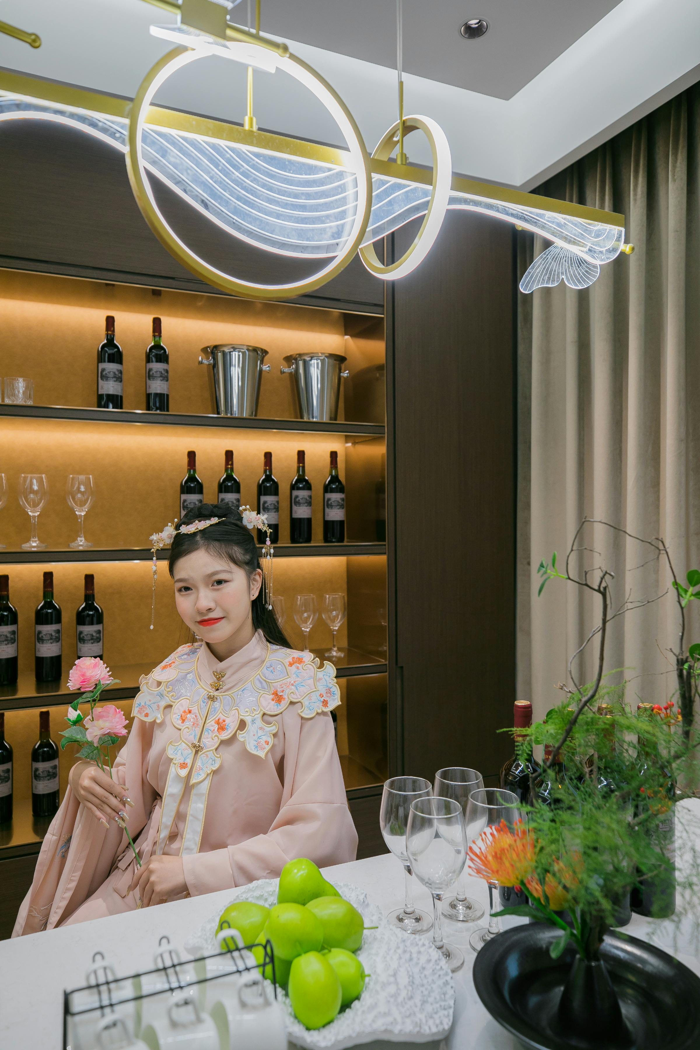 African Woman in Traditional Clothing Sitting and Holding a Calabash ...