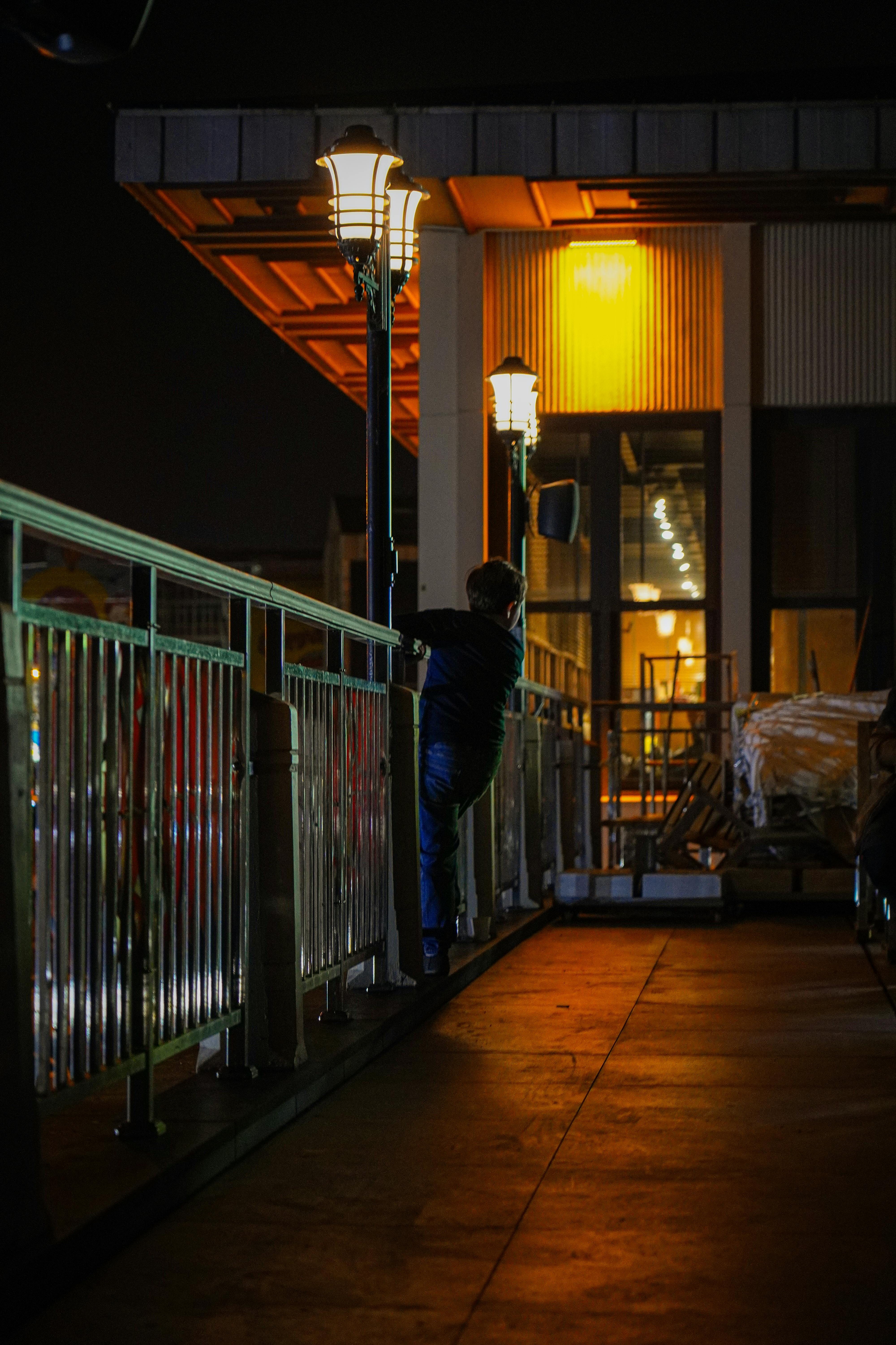 Boy Climbing on Handrail · Free Stock Photo